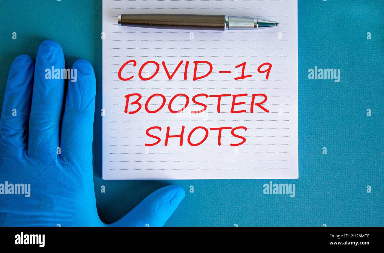 Covid-19 booster shots symbol. Words Covid-19 booster shots on white ...