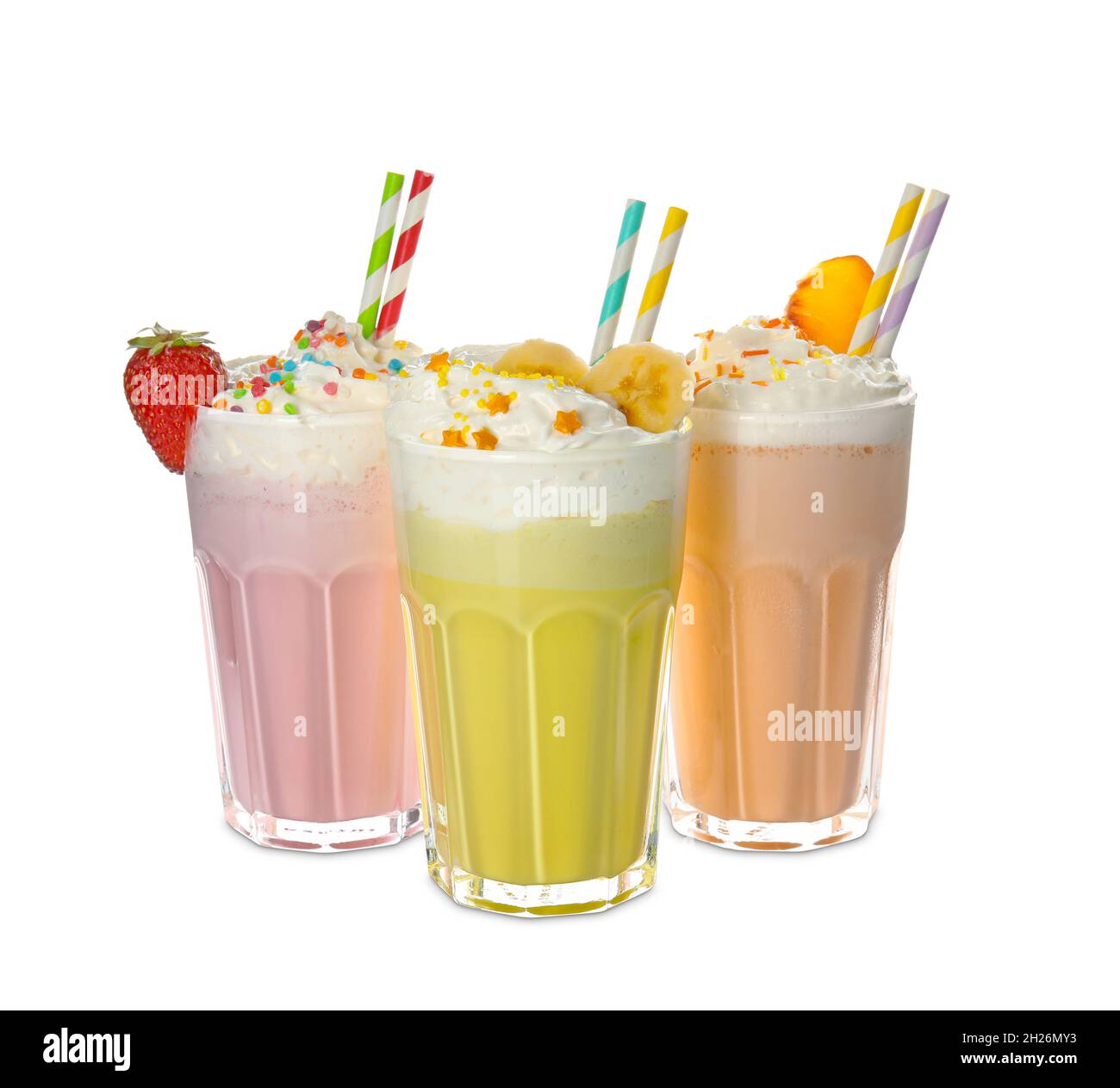 Glasses of tasty milk shakes on white background Stock Photo - Alamy