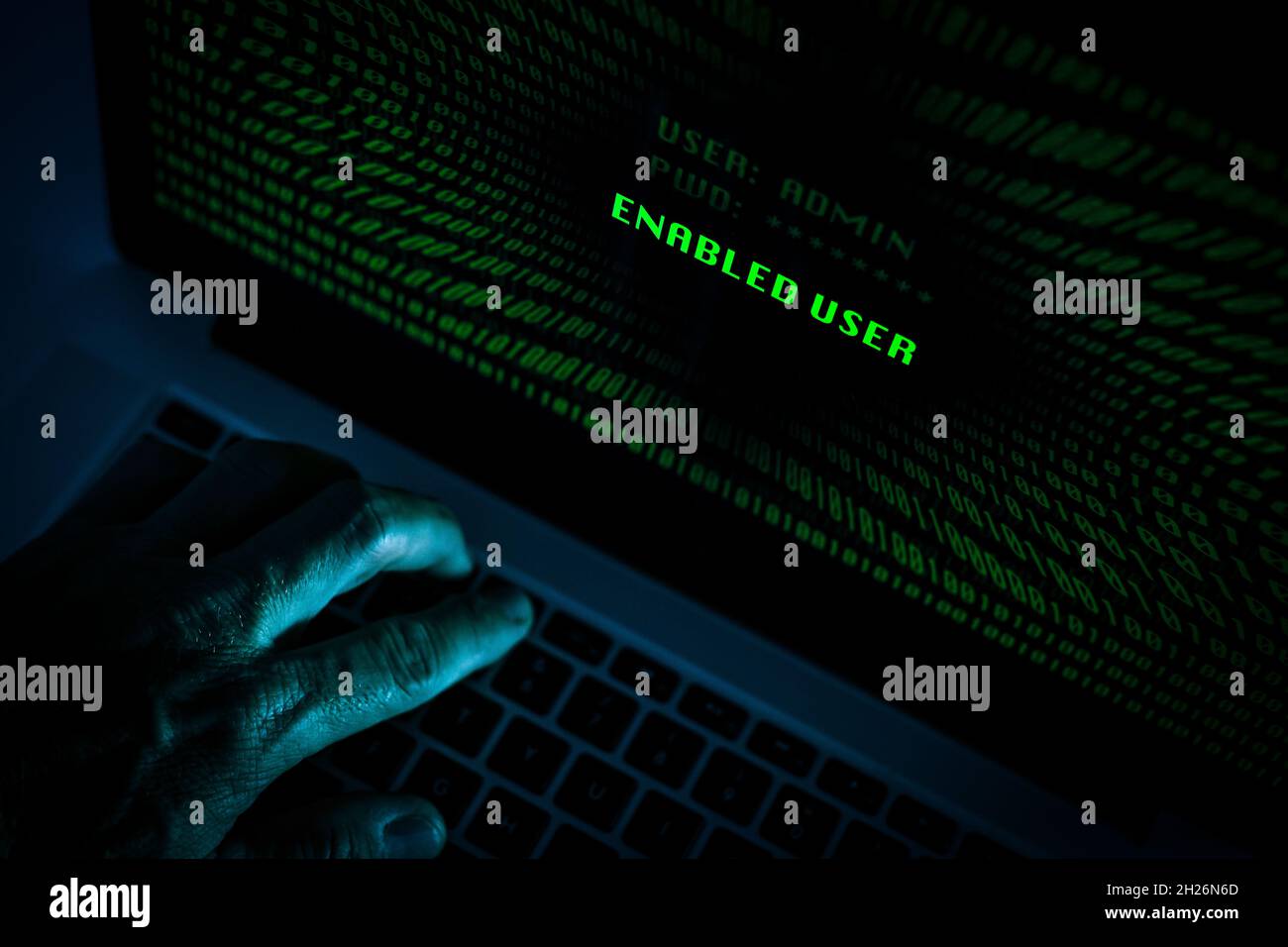 Hand typing on a laptop keyboard green numbers on display. Successful login with credentials ...
