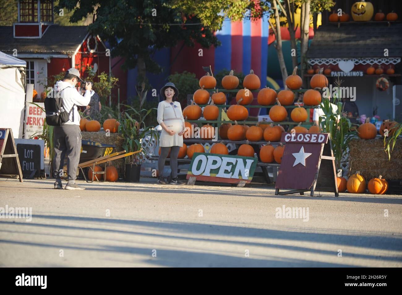 People take photos at the gate of Pumpkin Patch.Before Halloween, there ...