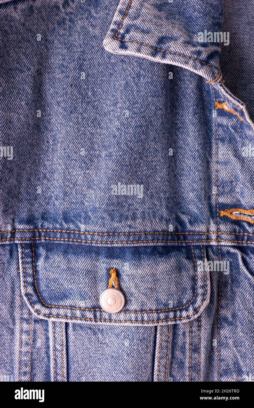 A close-up photo of one element of a common denim jacket Stock Photo ...