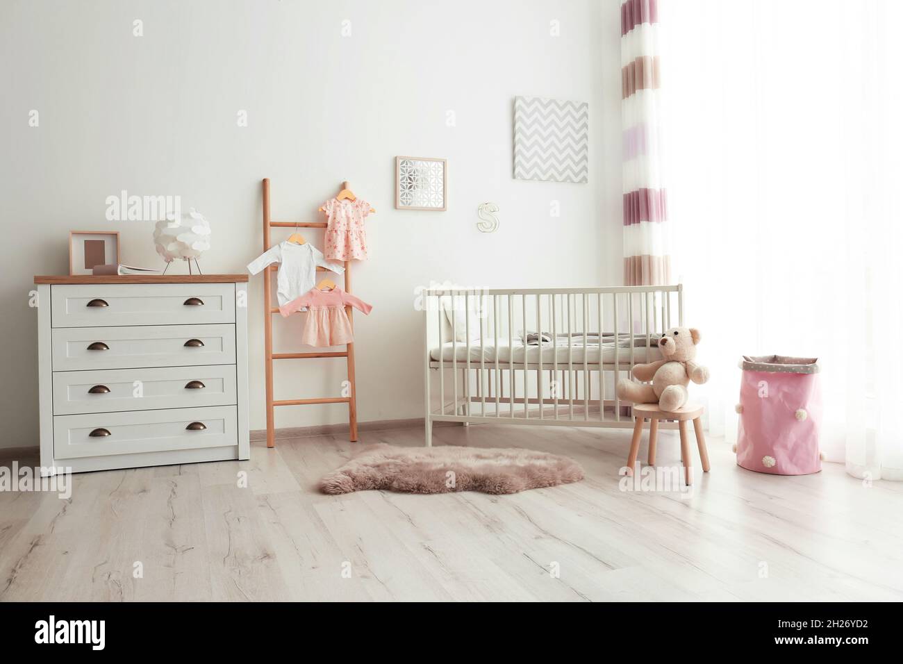 Cozy baby room interior with crib Stock Photo - Alamy