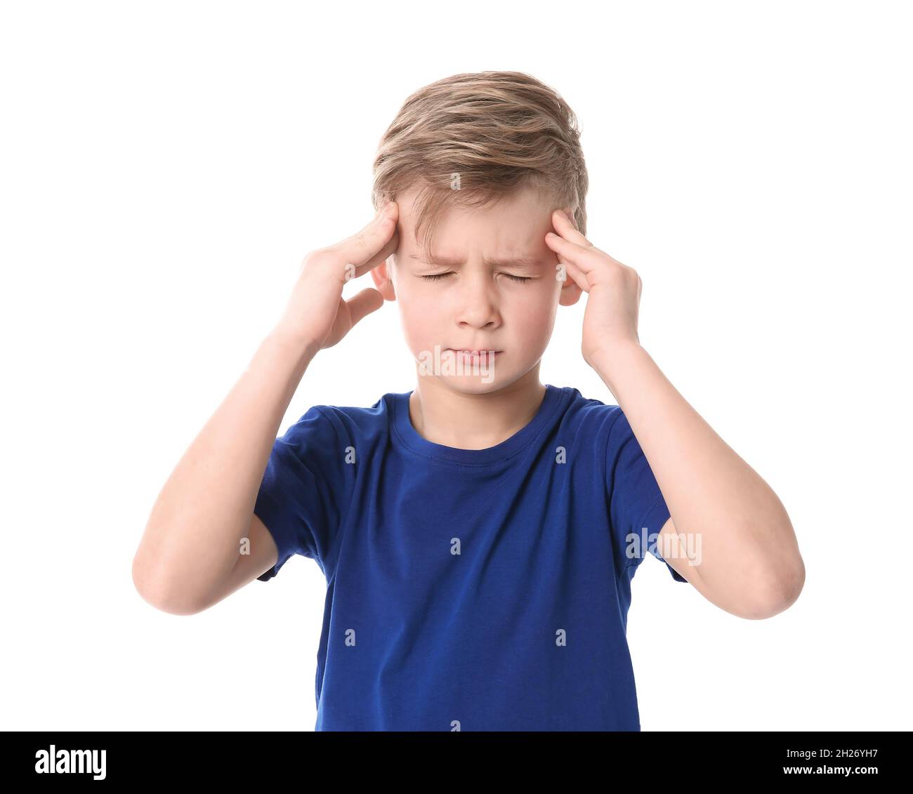Little boy suffering from headache on white background Stock Photo - Alamy