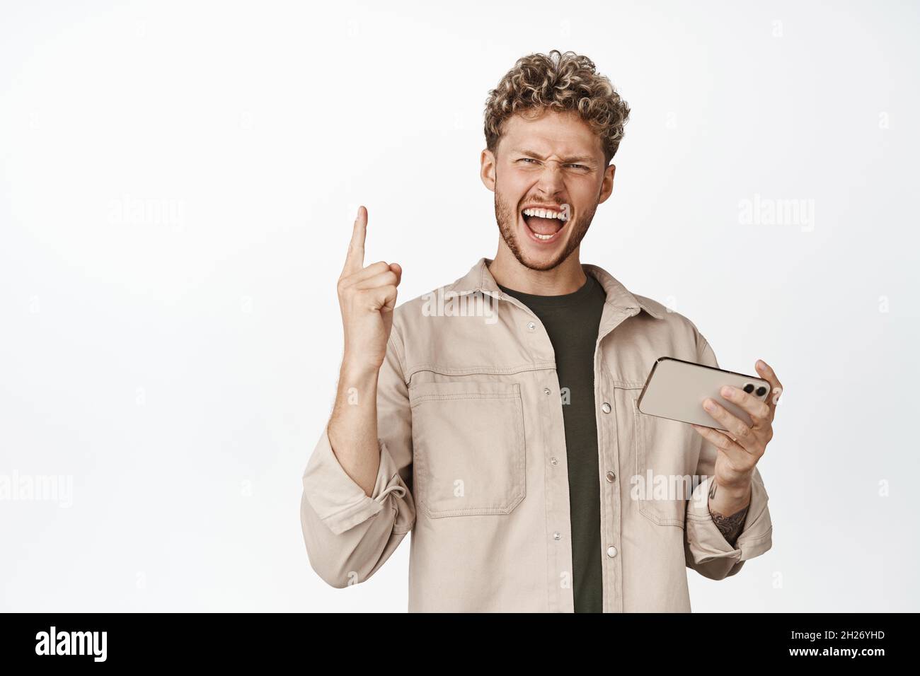 Guy watching phone hi-res stock photography and images - Alamy