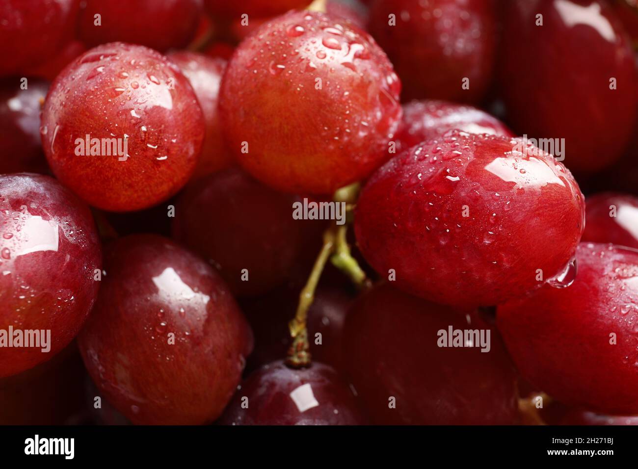 Bunch of red fresh ripe juicy grapes as background, closeup Stock Photo ...