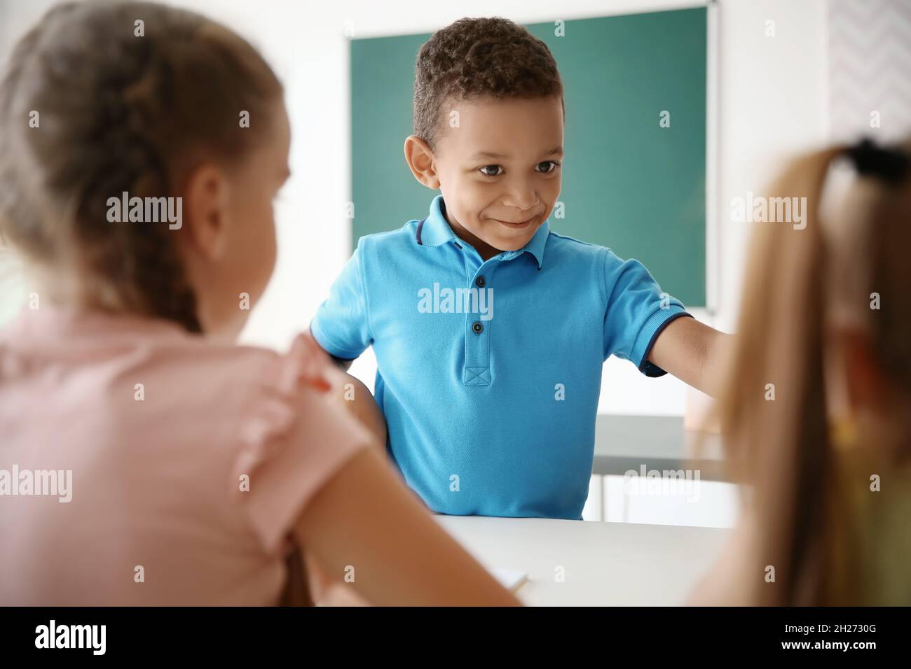 Cute little children in classroom. Elementary school Stock Photo - Alamy