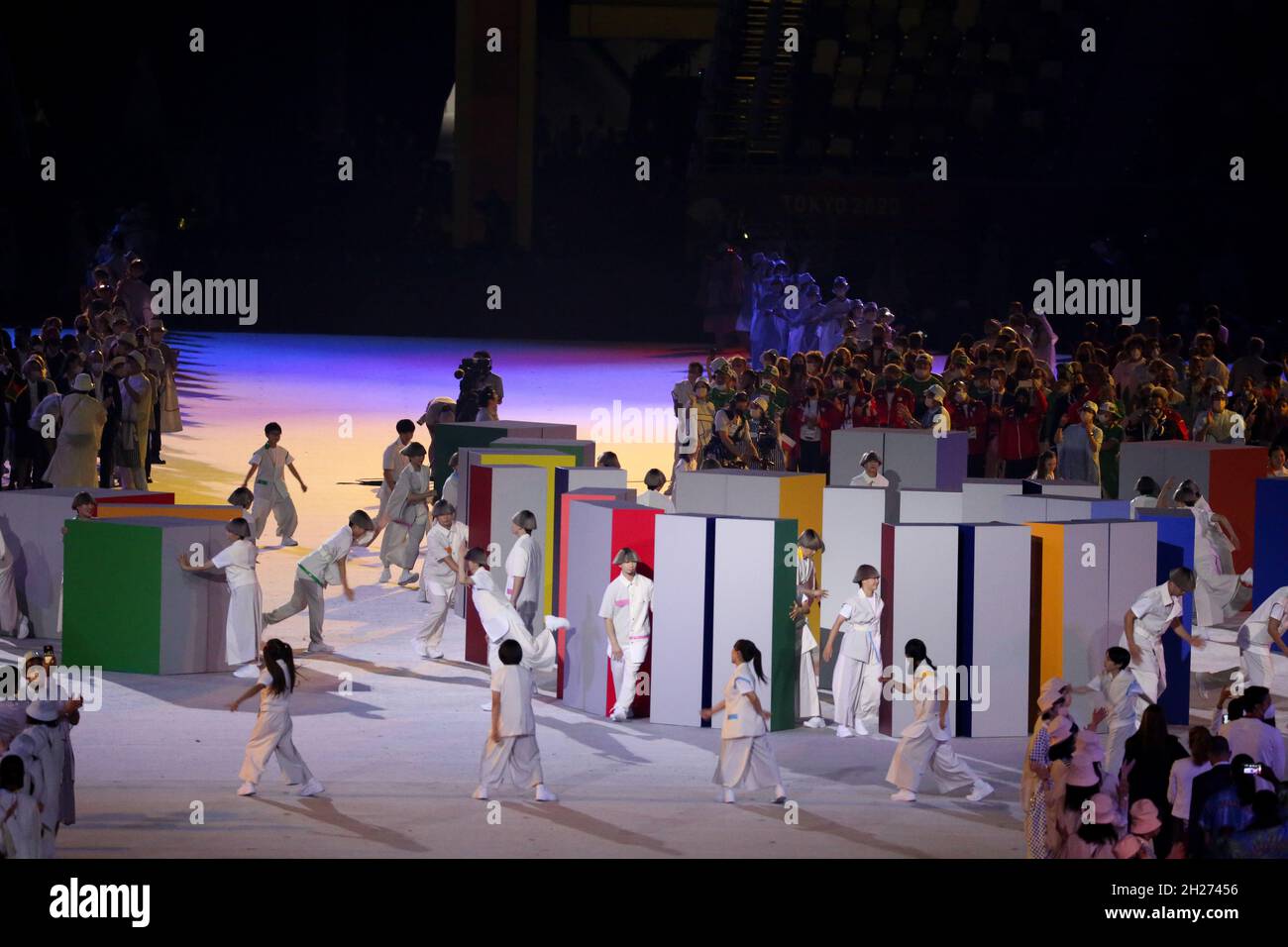 JULY 23rd, 2021 - TOKYO, JAPAN: groups of all ages dance around boxes ...