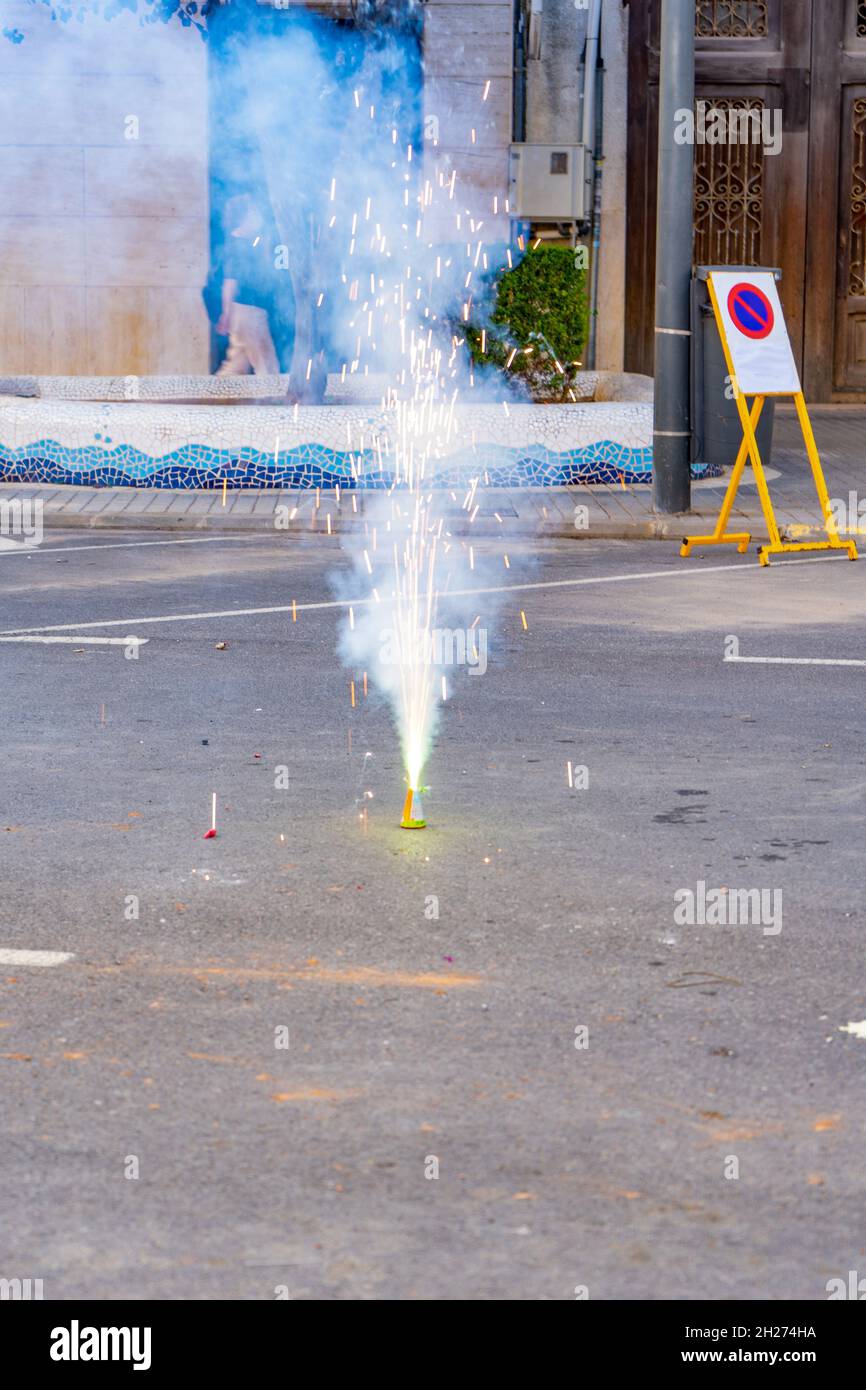Colorful smoke bomb smoking in the middle of the street Stock Photo - Alamy