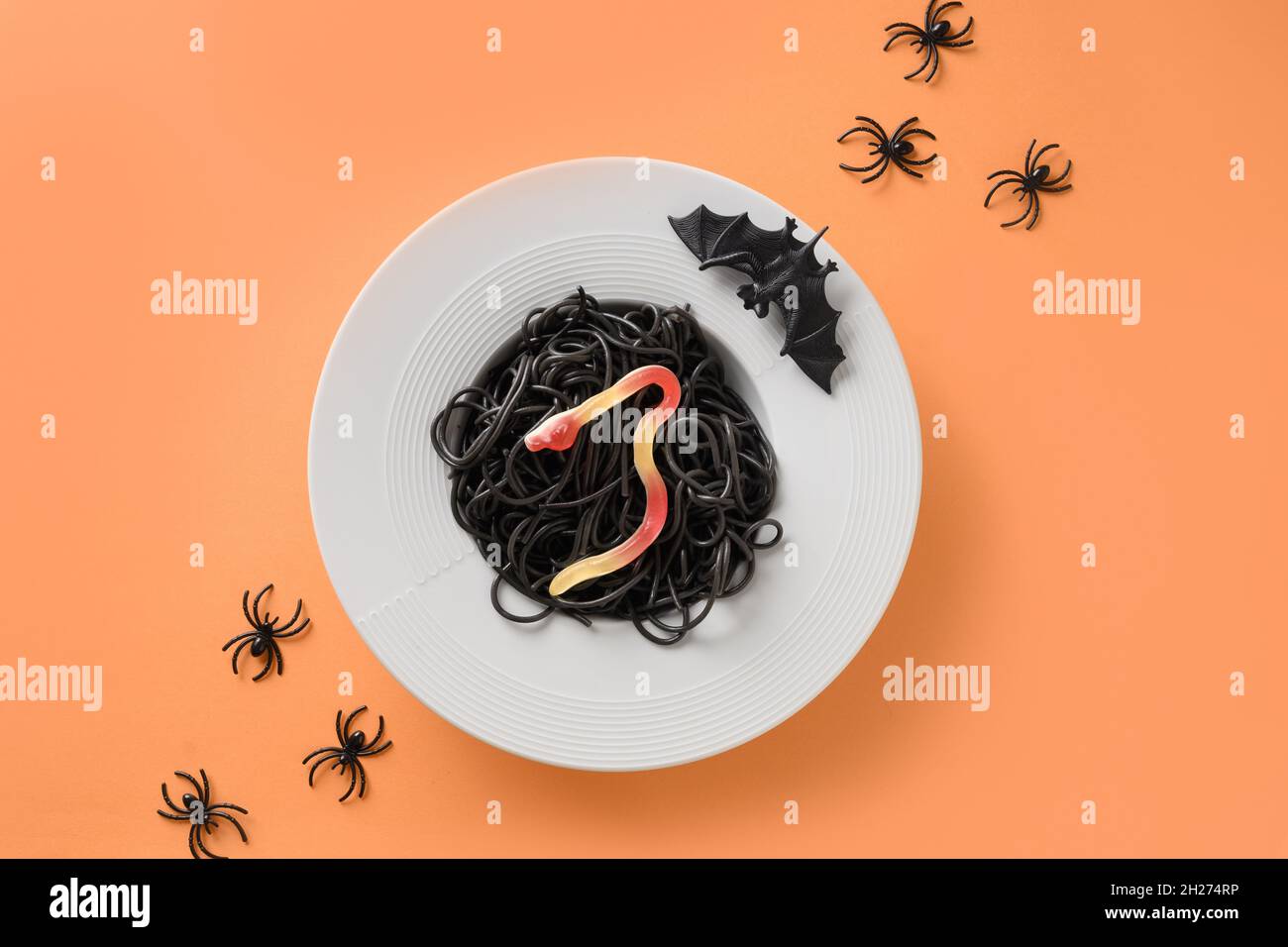 Halloween horror black pasta squid ink decorated funny bat and shake in ...