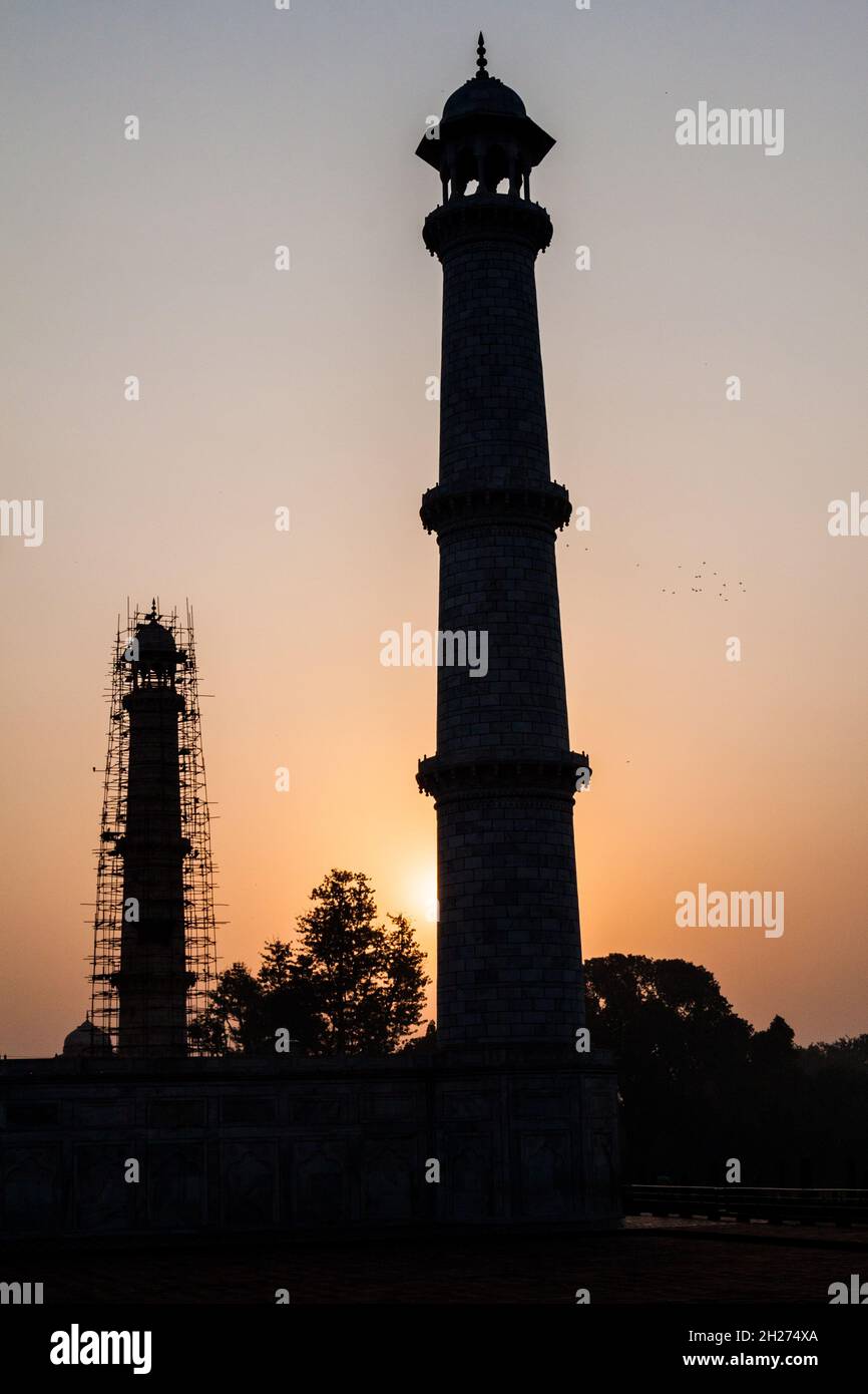 Sun is rising behind minarets of Taj Mahal in Agra, India Stock Photo ...