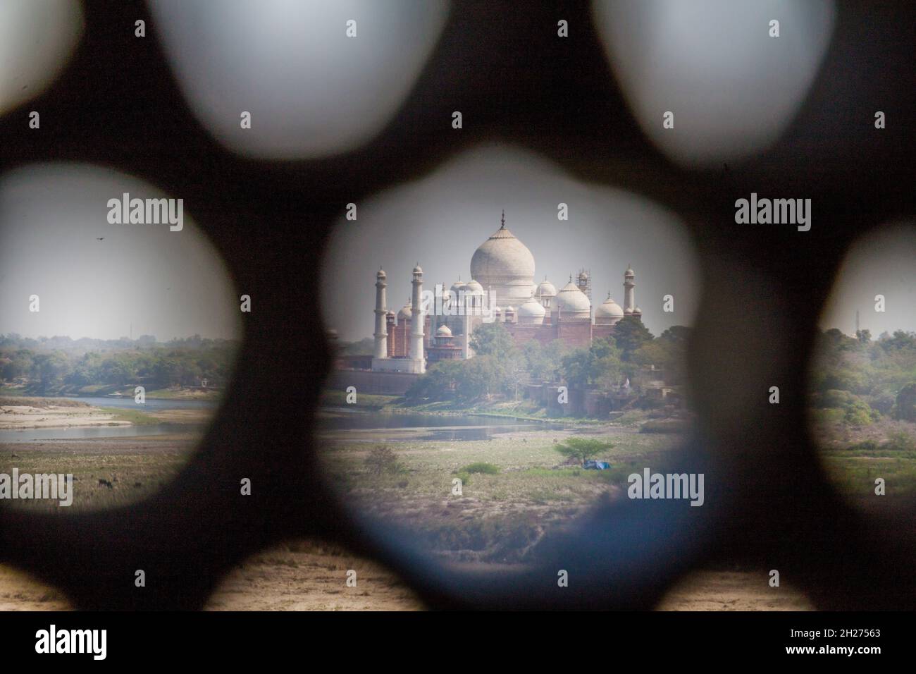 Taj Mahal as viewed from a window of Agra Fort, Uttar Pradesh state ...