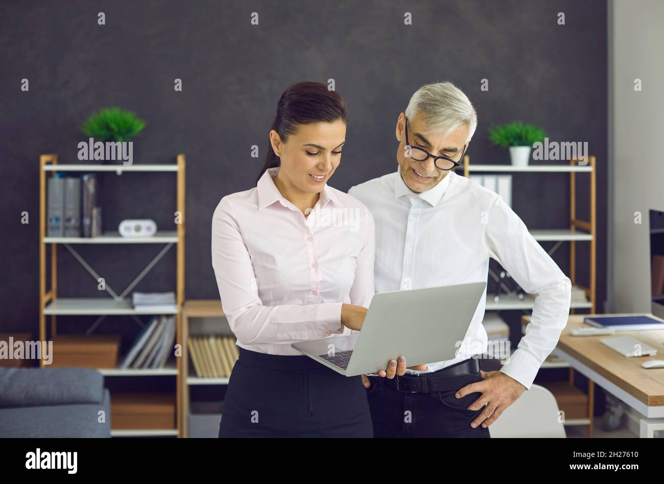 Two people looking at computer hi-res stock photography and images - Alamy