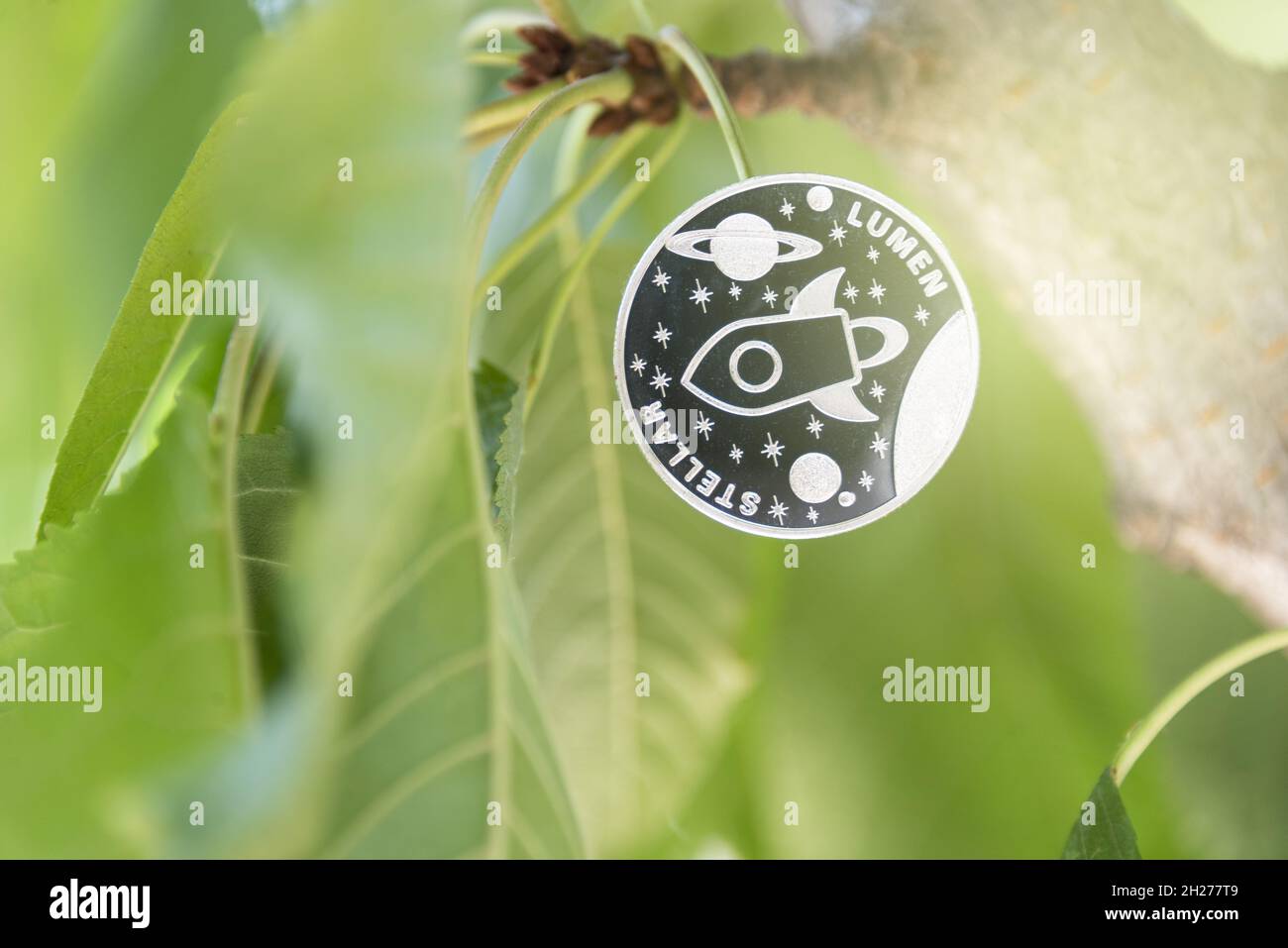 Stellar digital crypto currency. Stack of silver coins. Cyber money ...