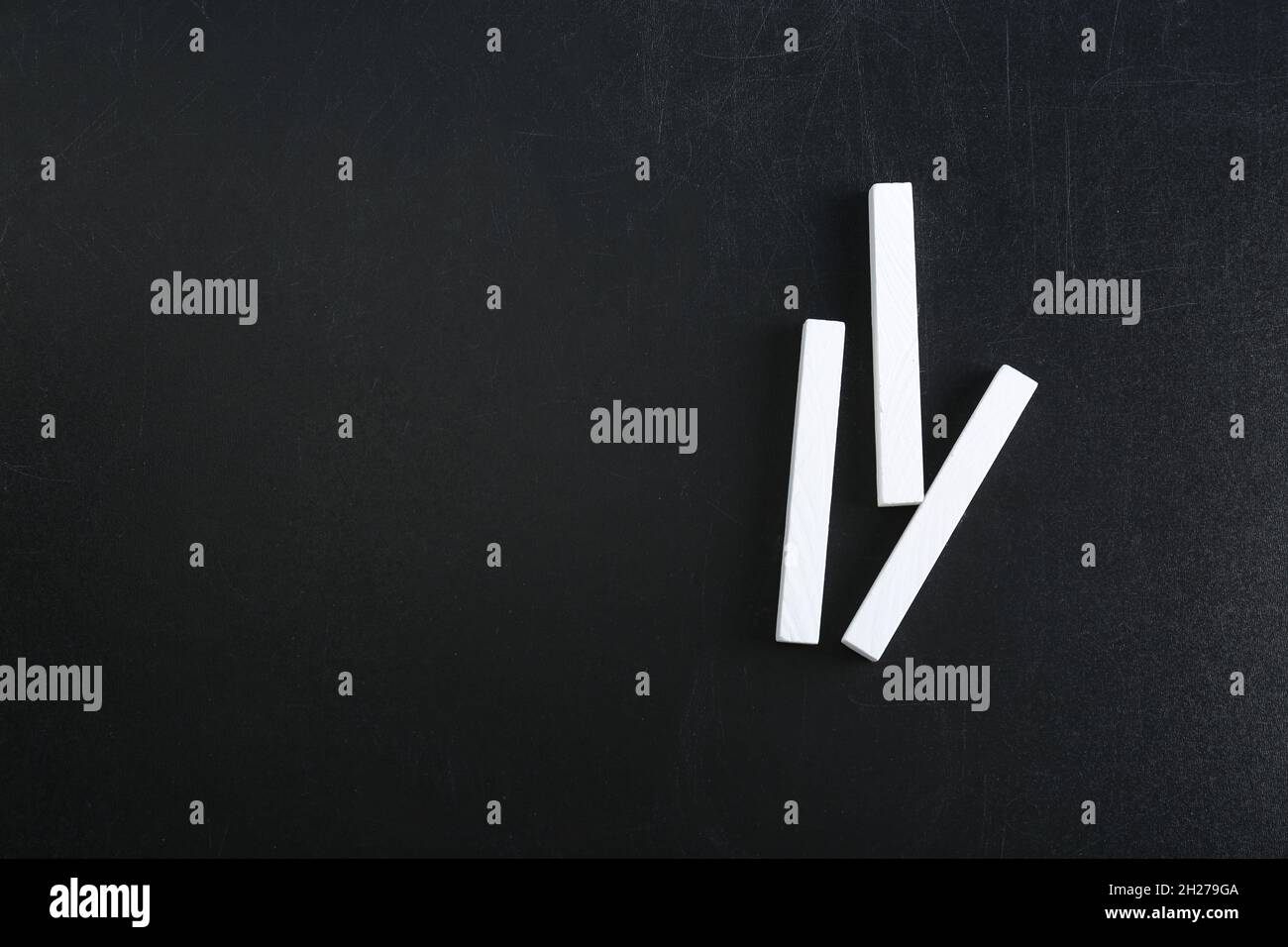 Pieces of chalk on blackboard, top view Stock Photo - Alamy