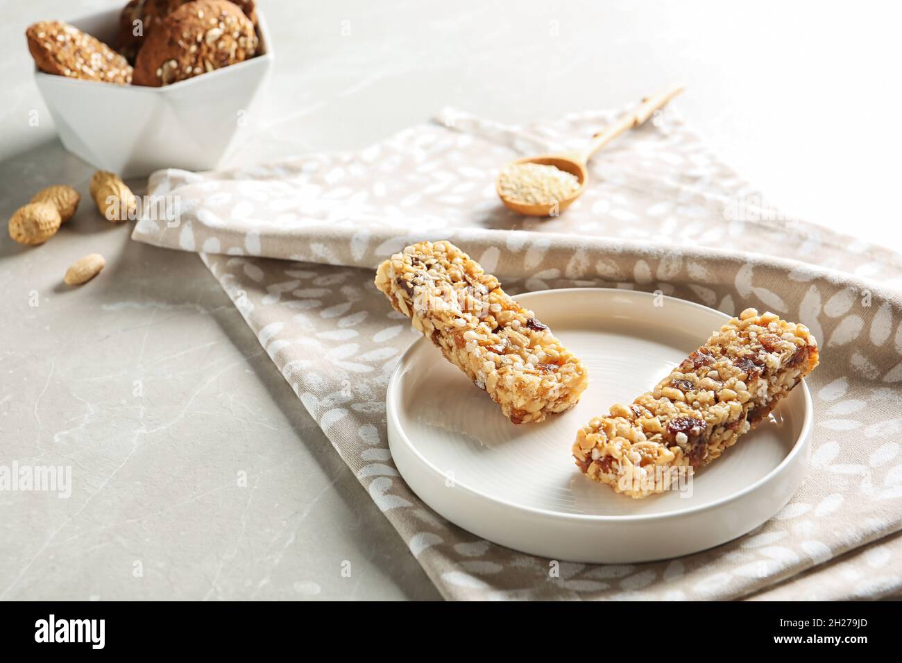 Plate with different homemade grain cereal bars on table. Healthy snack ...