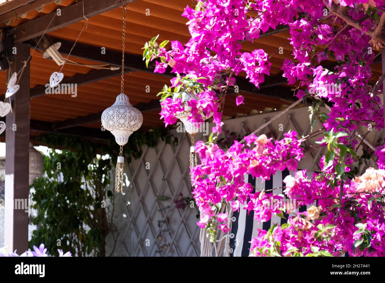 kazoo lamps hanging on a veranda swing in the summer breeze Stock Photo ...