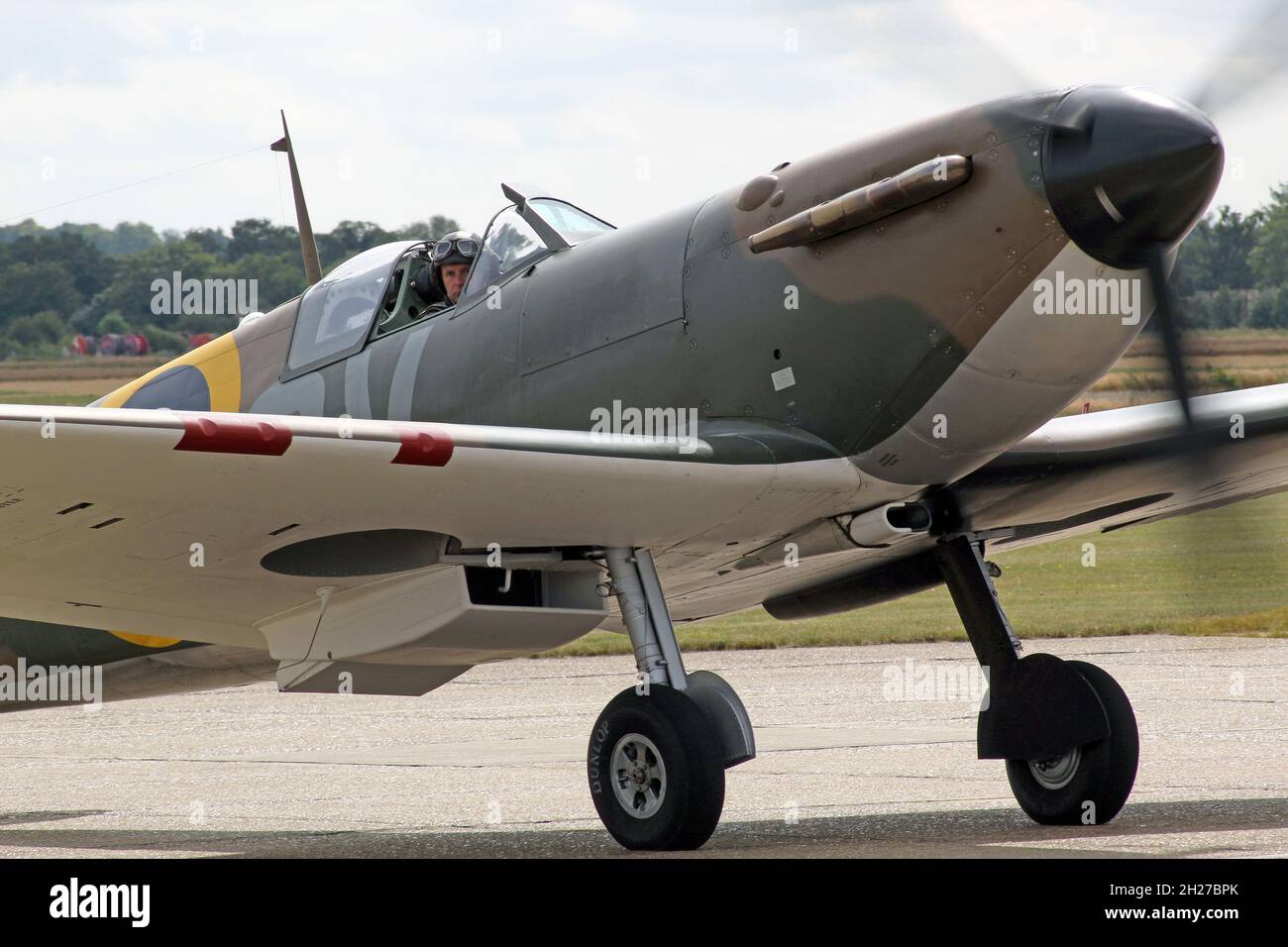 A Supermarine Spitfire getting ready for a flypast at IWM Duxford in ...