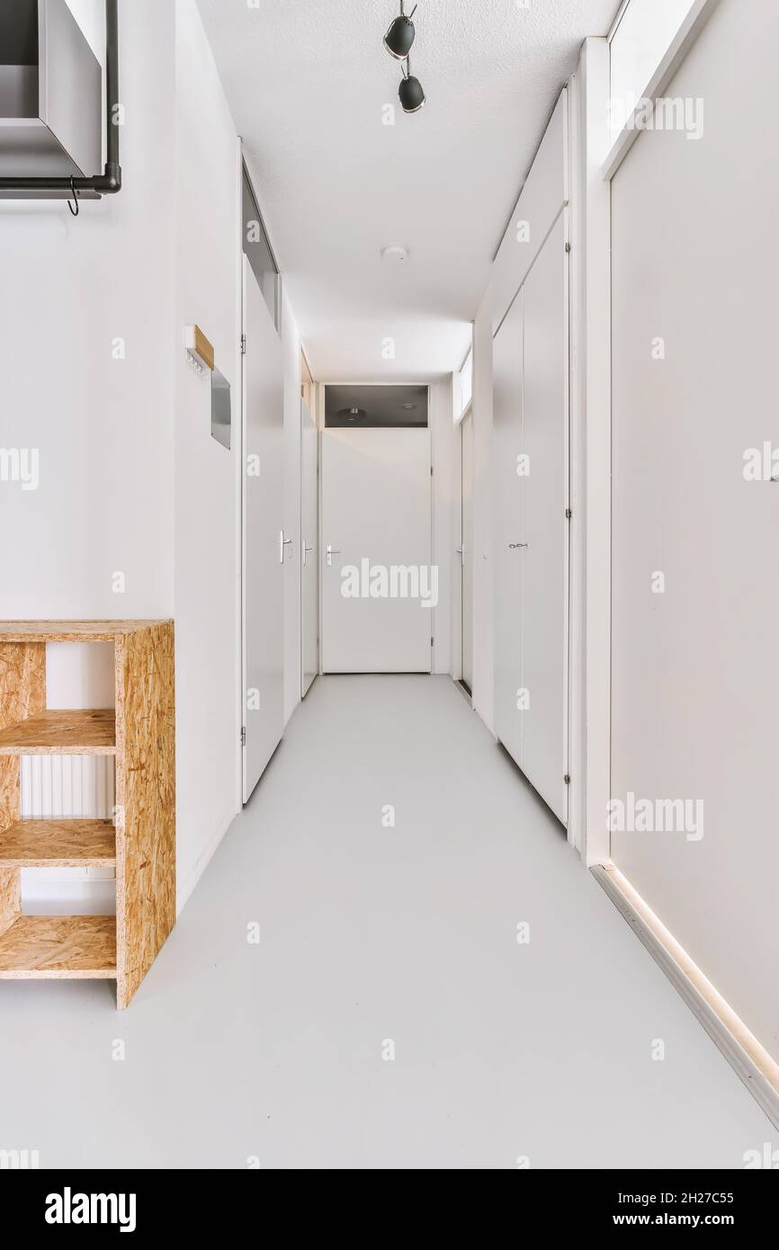 A long empty corridor designed in minimalistic style Stock Photo - Alamy