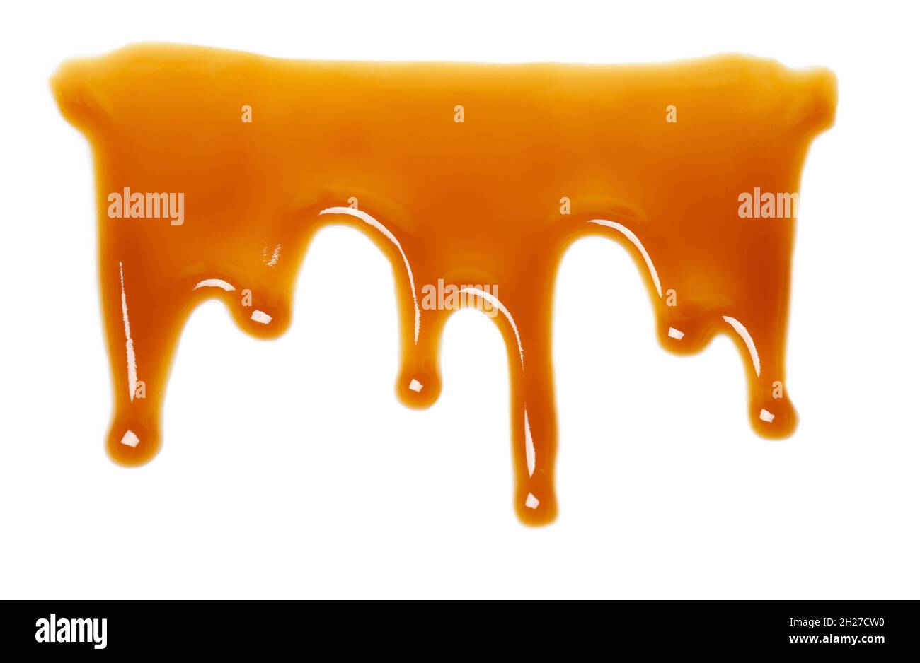 Delicious caramel sauce on white background Stock Photo - Alamy