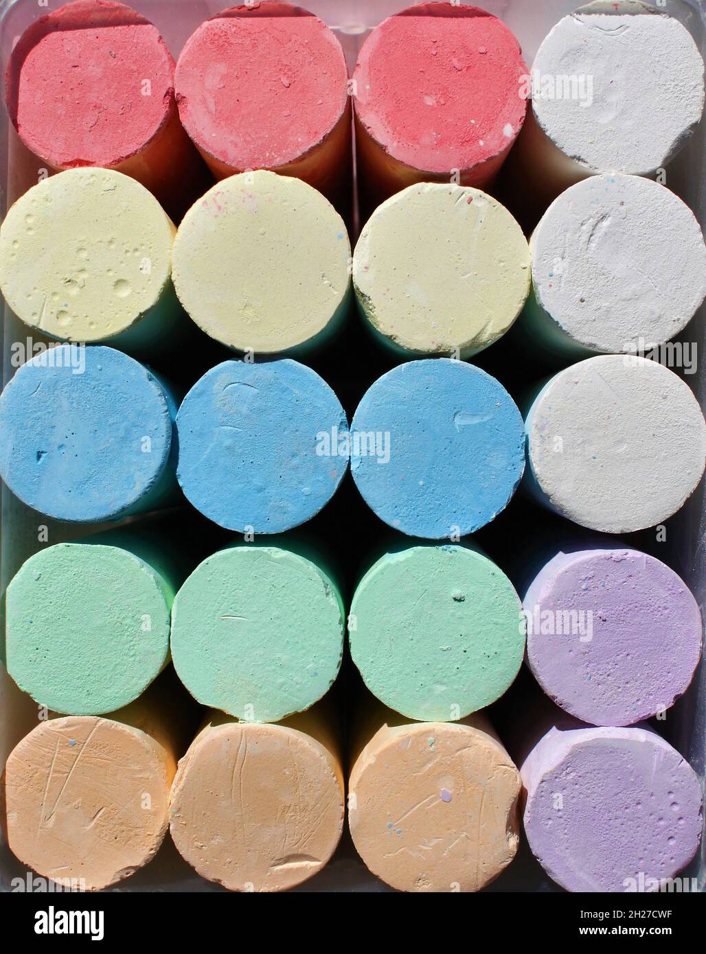 colorful round street crayon in a box assorted colors seen from above ...