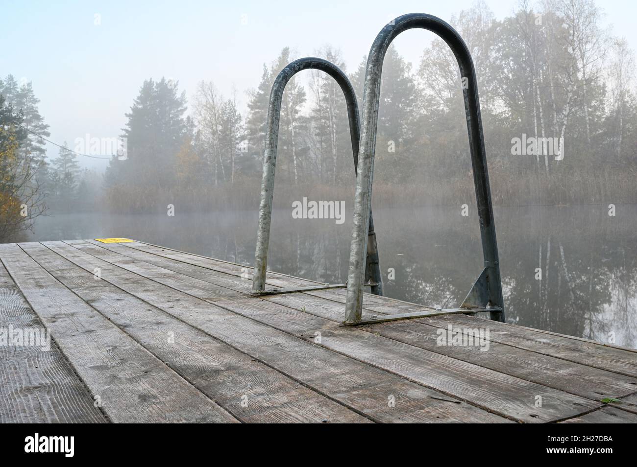 jetty and bathing ladder early october morning Stock Photo - Alamy