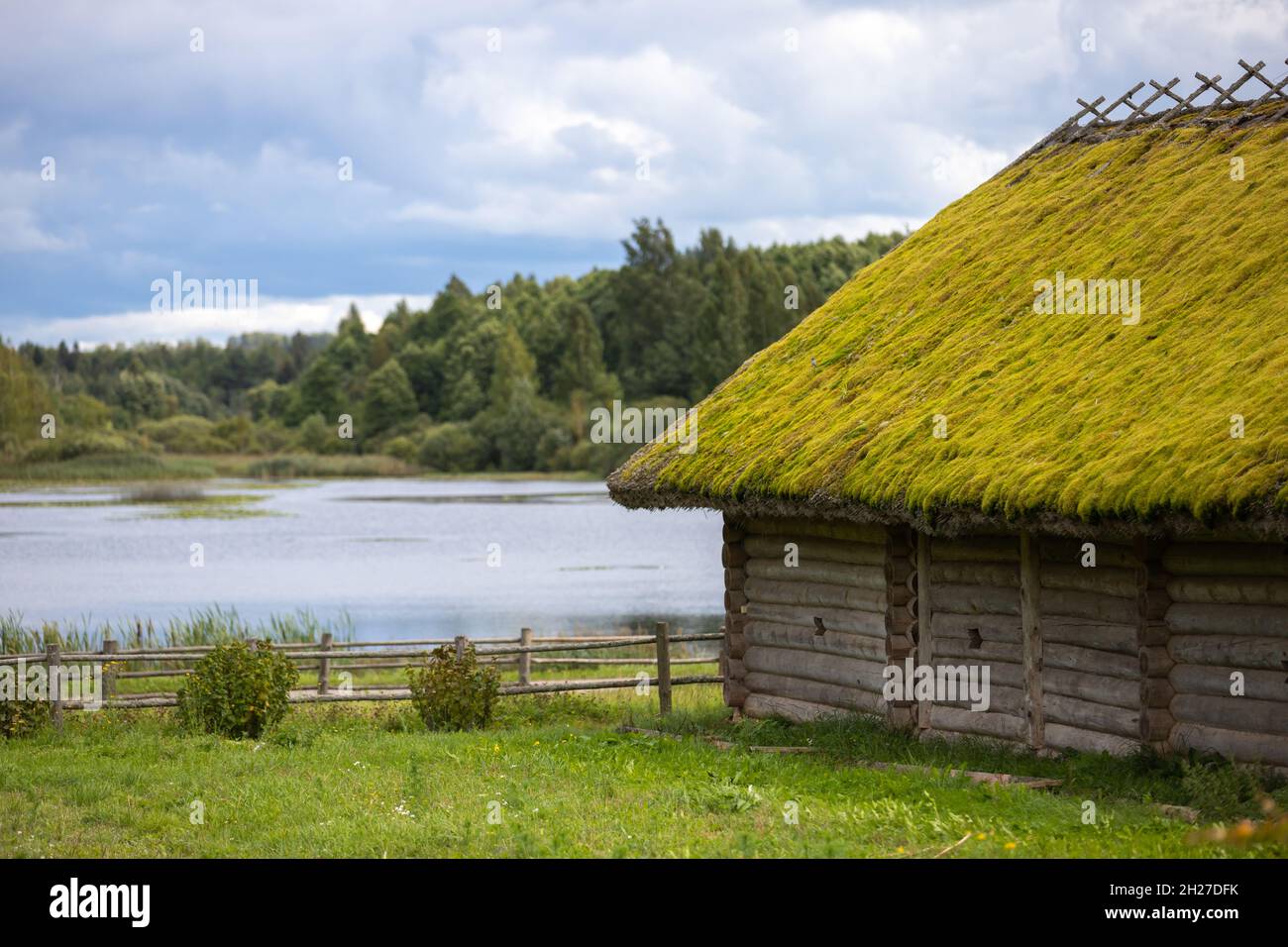 Rural Russian landscape with an old wooden house on a lake coast Stock ...