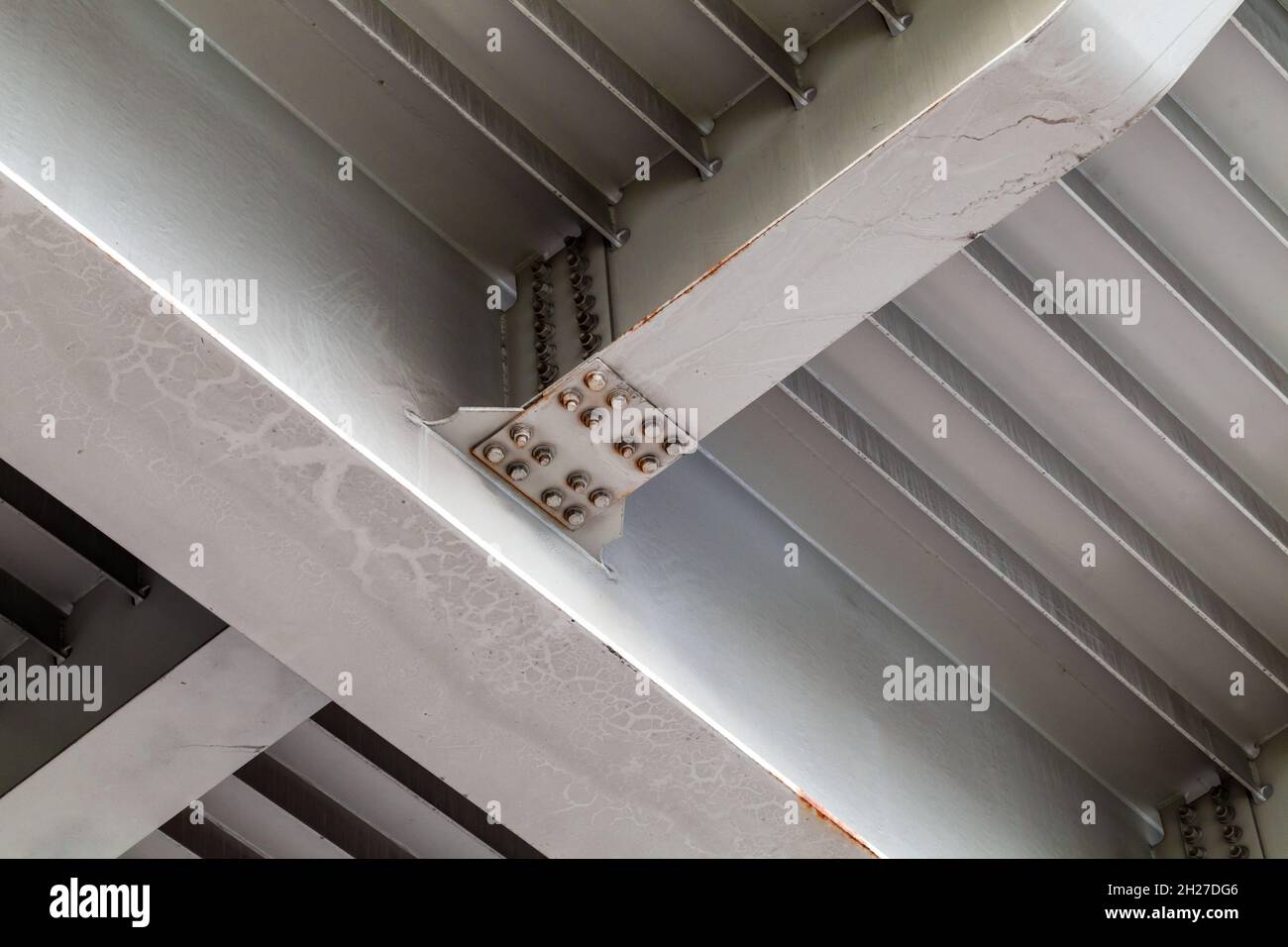 Steel bridge span bottom view, gray girders connection Stock Photo - Alamy