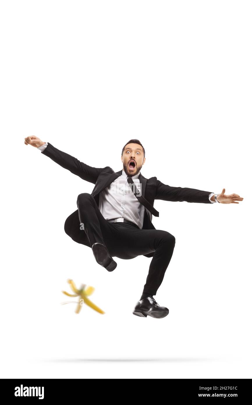 Businessman Falling Down And Slipping On A Banana Peel Isolated On