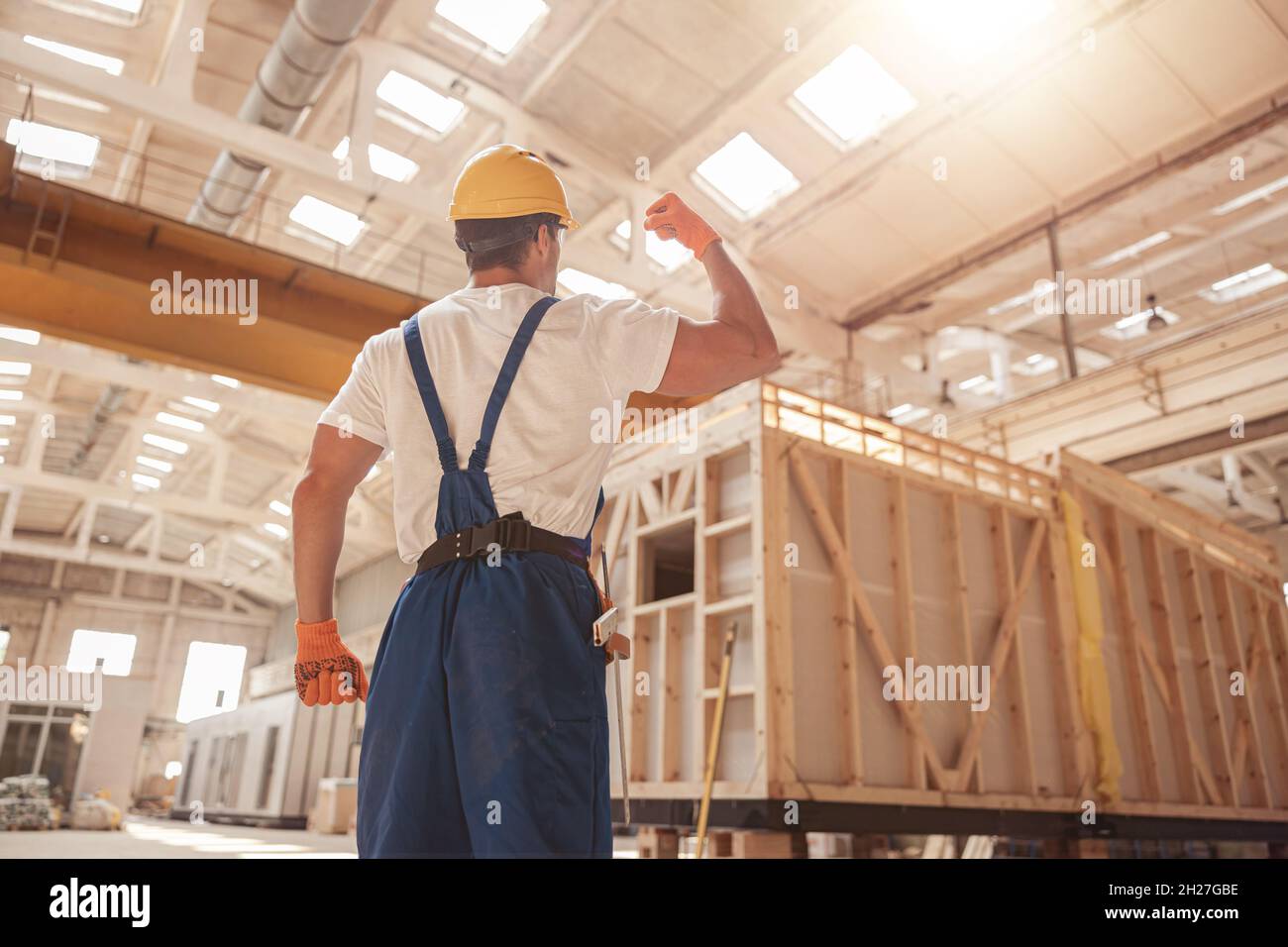 Athletic male builder demonstrating his muscular arm Stock Photo - Alamy