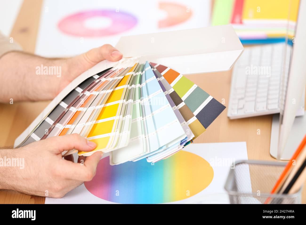 Designer with paint color palette samples at table, closeup Stock Photo ...