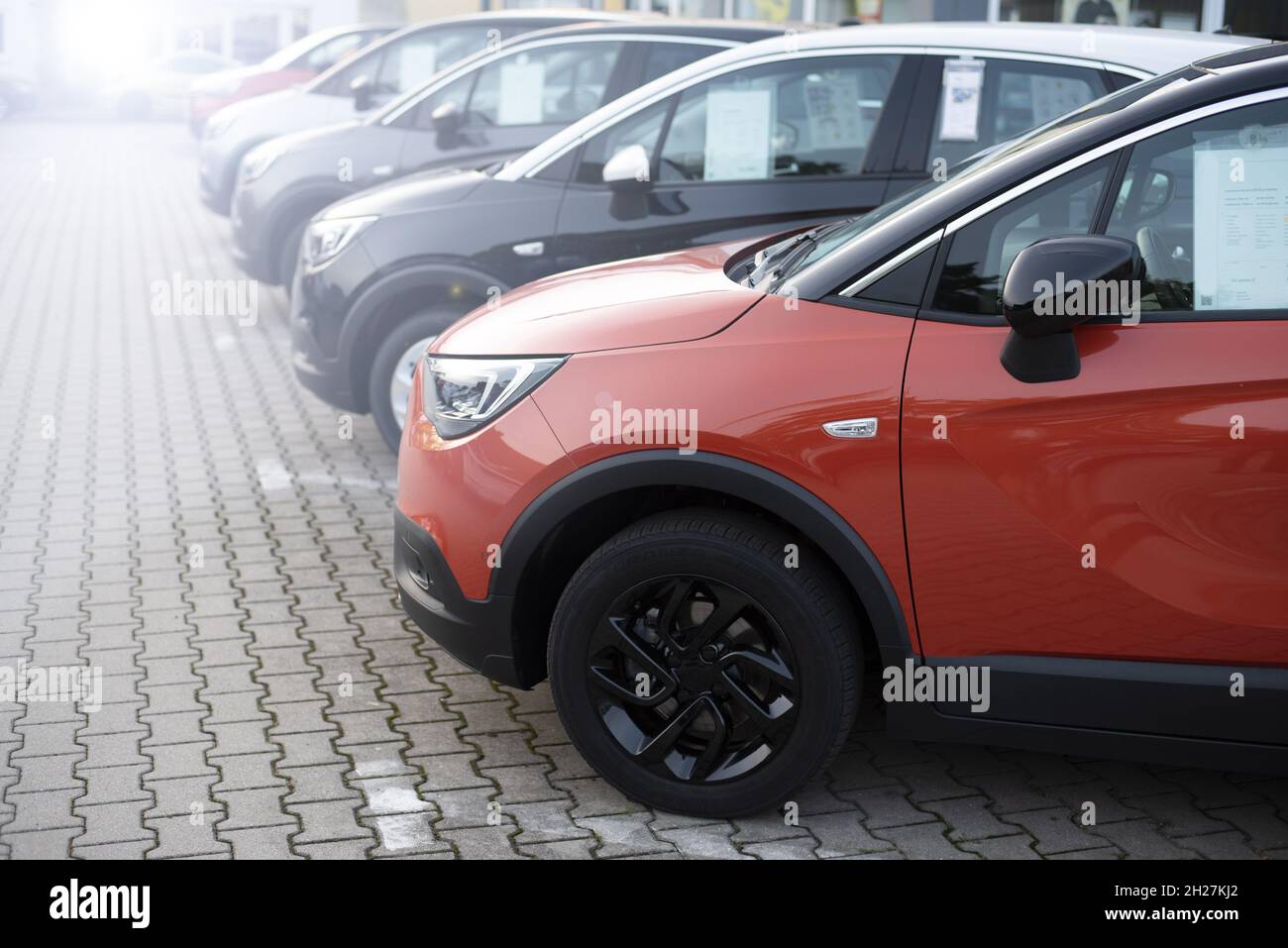 Closeup shot of parked cars in a parking Stock Photo - Alamy