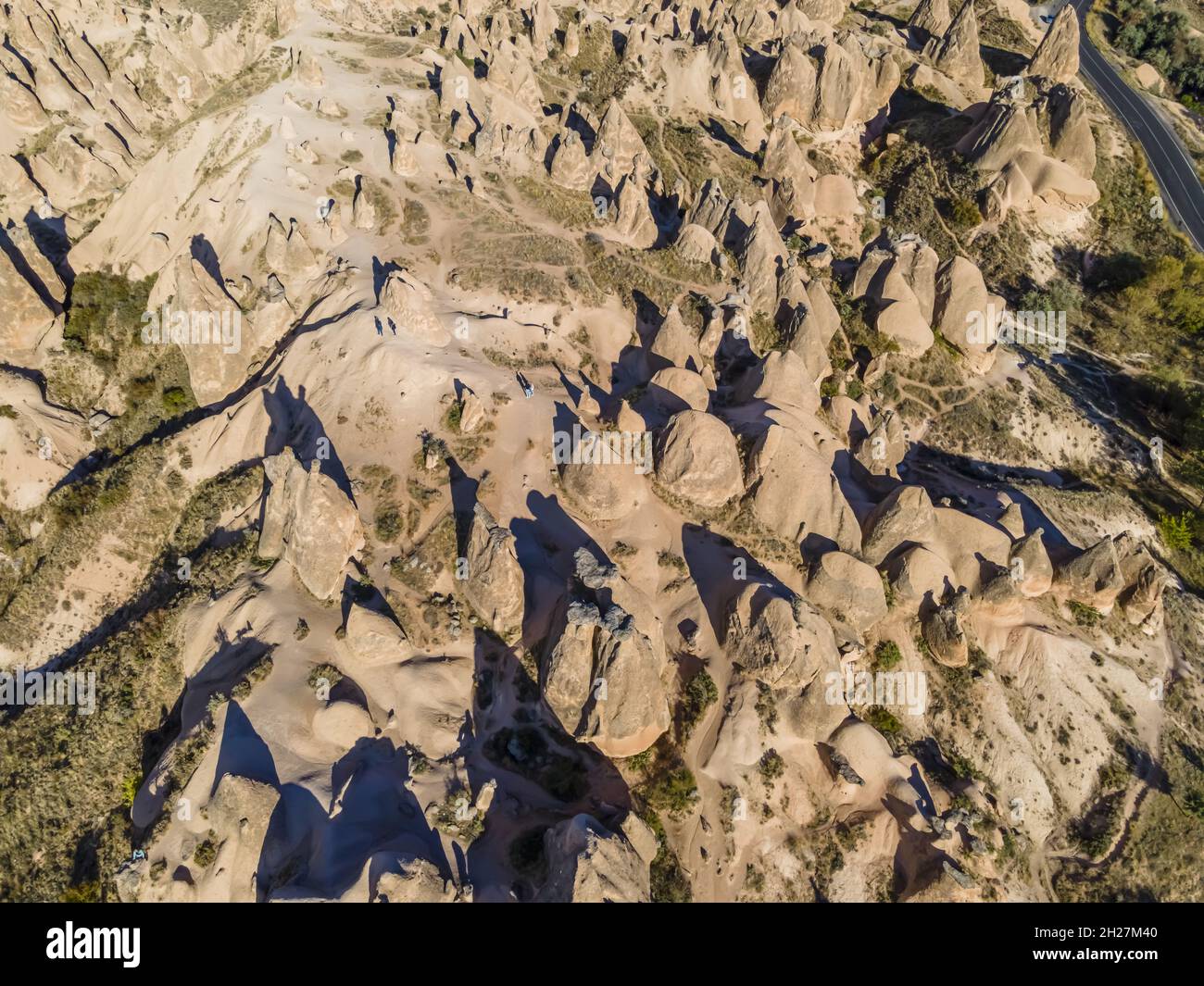 Aerial view of a vast mountainous area in Cappadocia, Turkey, filled ...