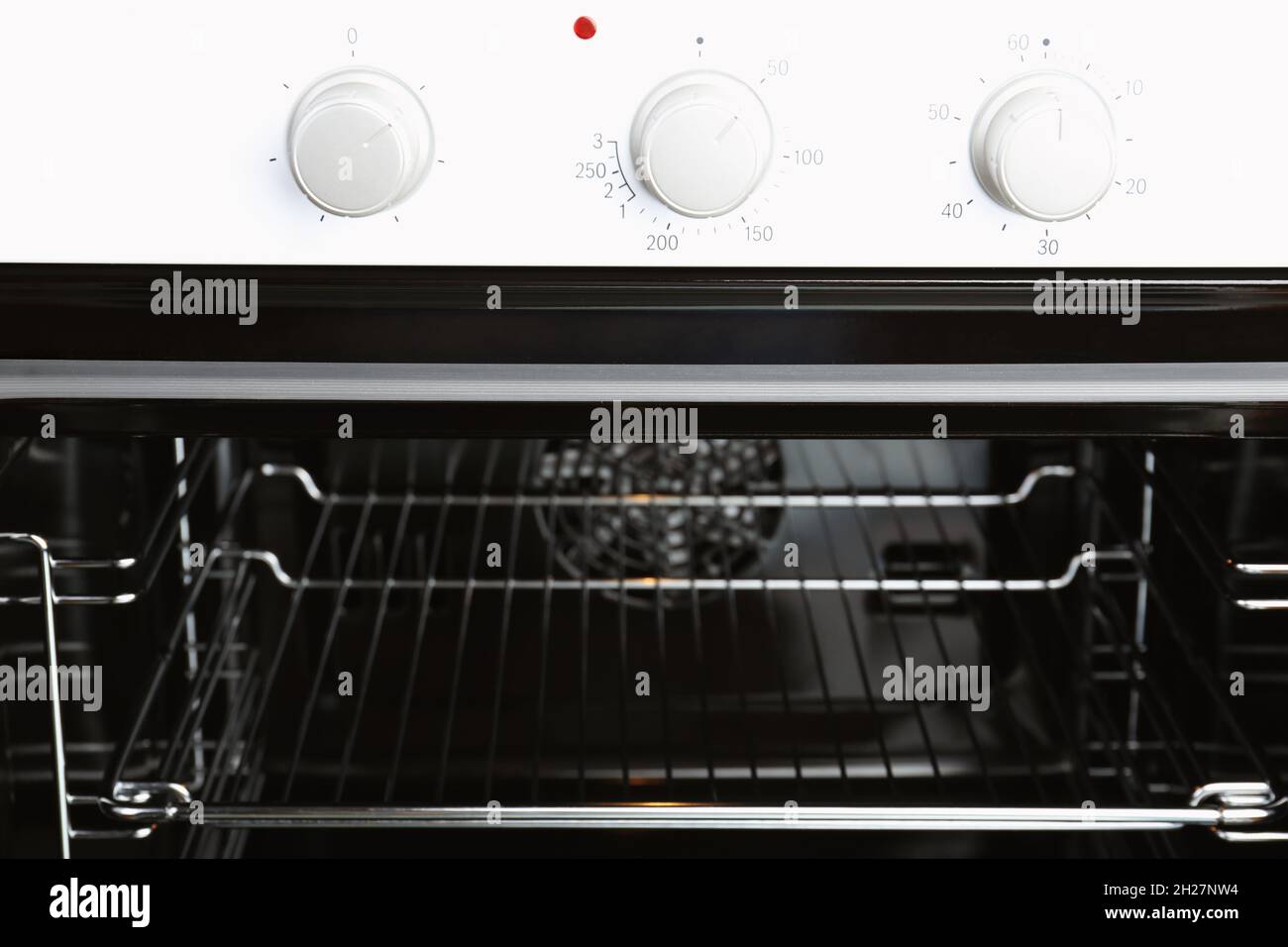 Open empty electric oven with rack, closeup Stock Photo - Alamy