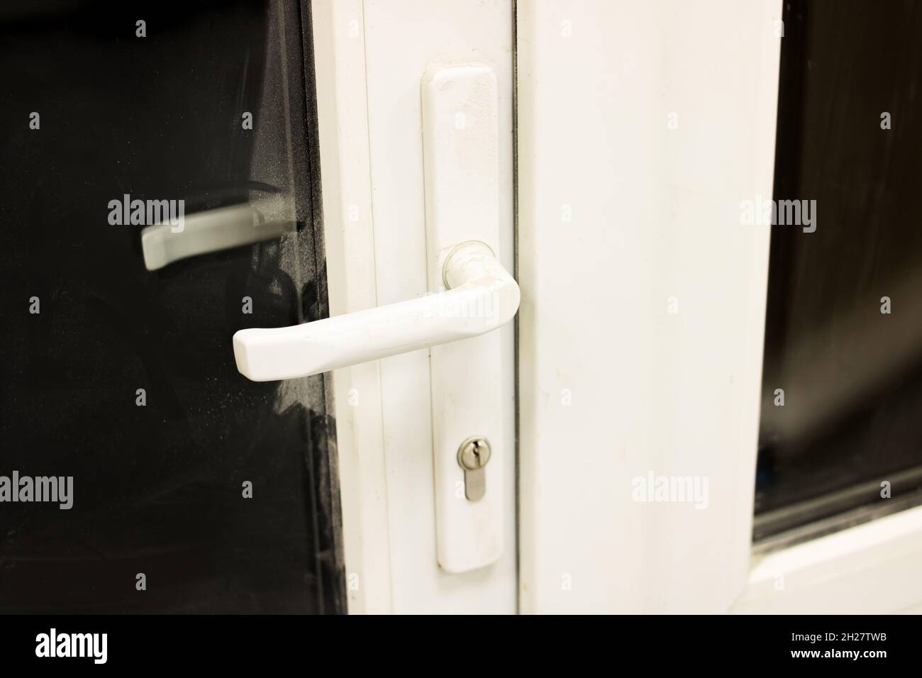 Glass package window handle at night close up Stock Photo - Alamy