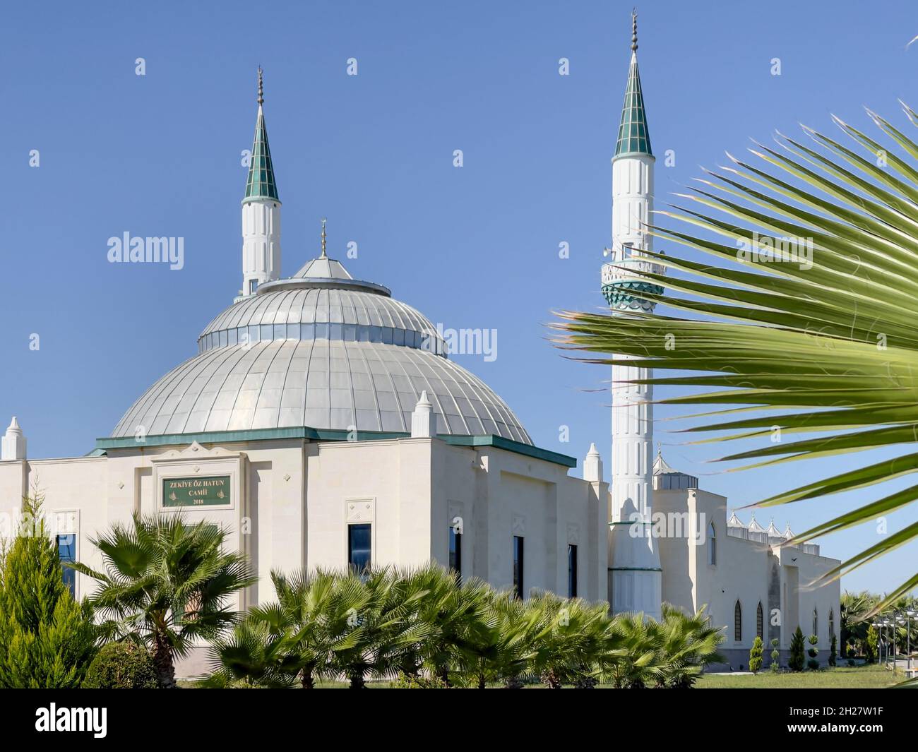 a new mosque with 2 towers and the sky is blue Stock Photo - Alamy
