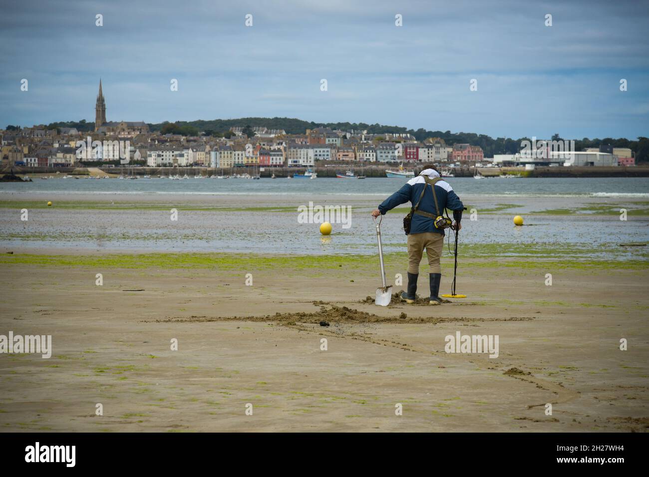 caucasian man using a metal detector on the beach on brittany Stock ...