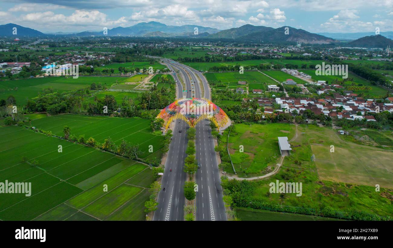 Aerial view of the city colorful Monument Tembolak Rainbow on Mataram ...
