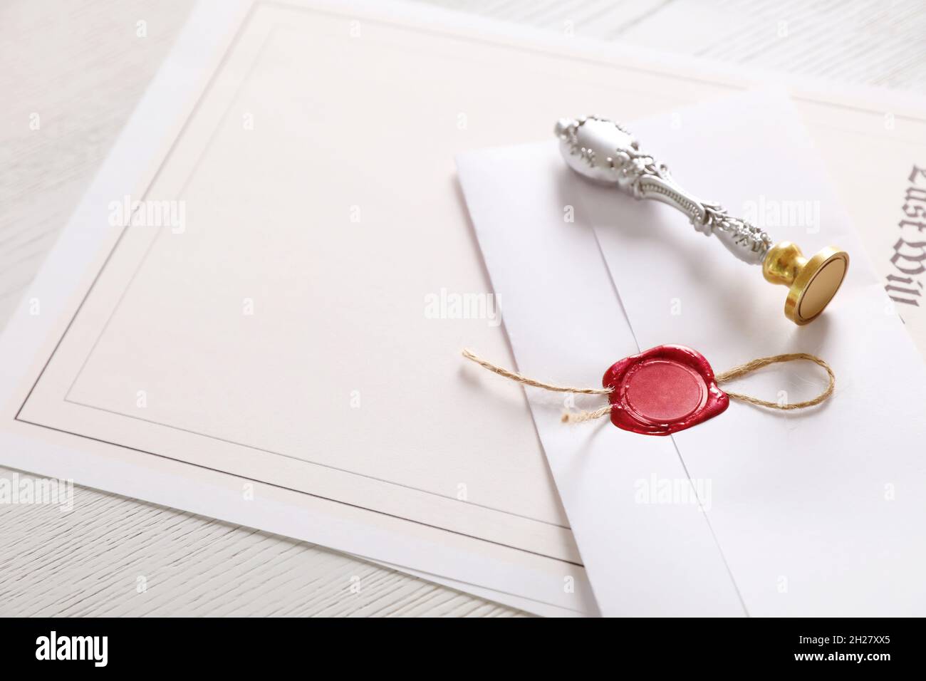 Vintage notary stamp and documents on white wooden background, closeup ...