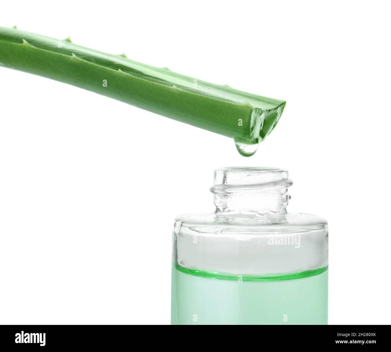 Aloe vera juice dripping from plant into bottle Stock Photo - Alamy