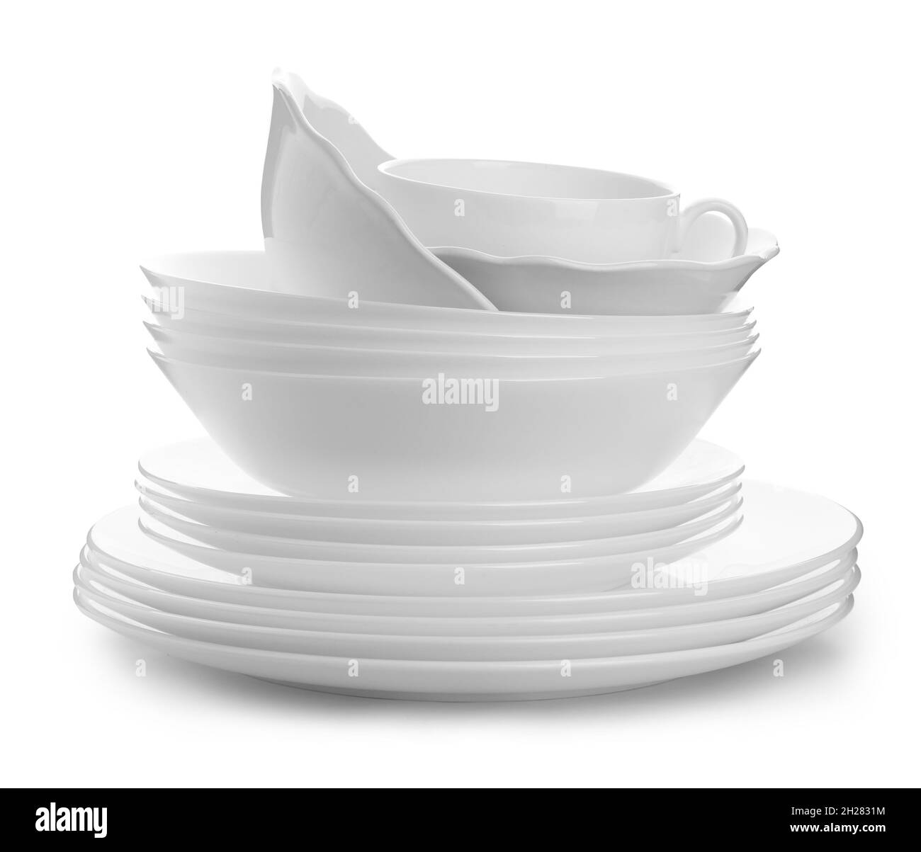 Stack of plates and cup on white background Stock Photo - Alamy