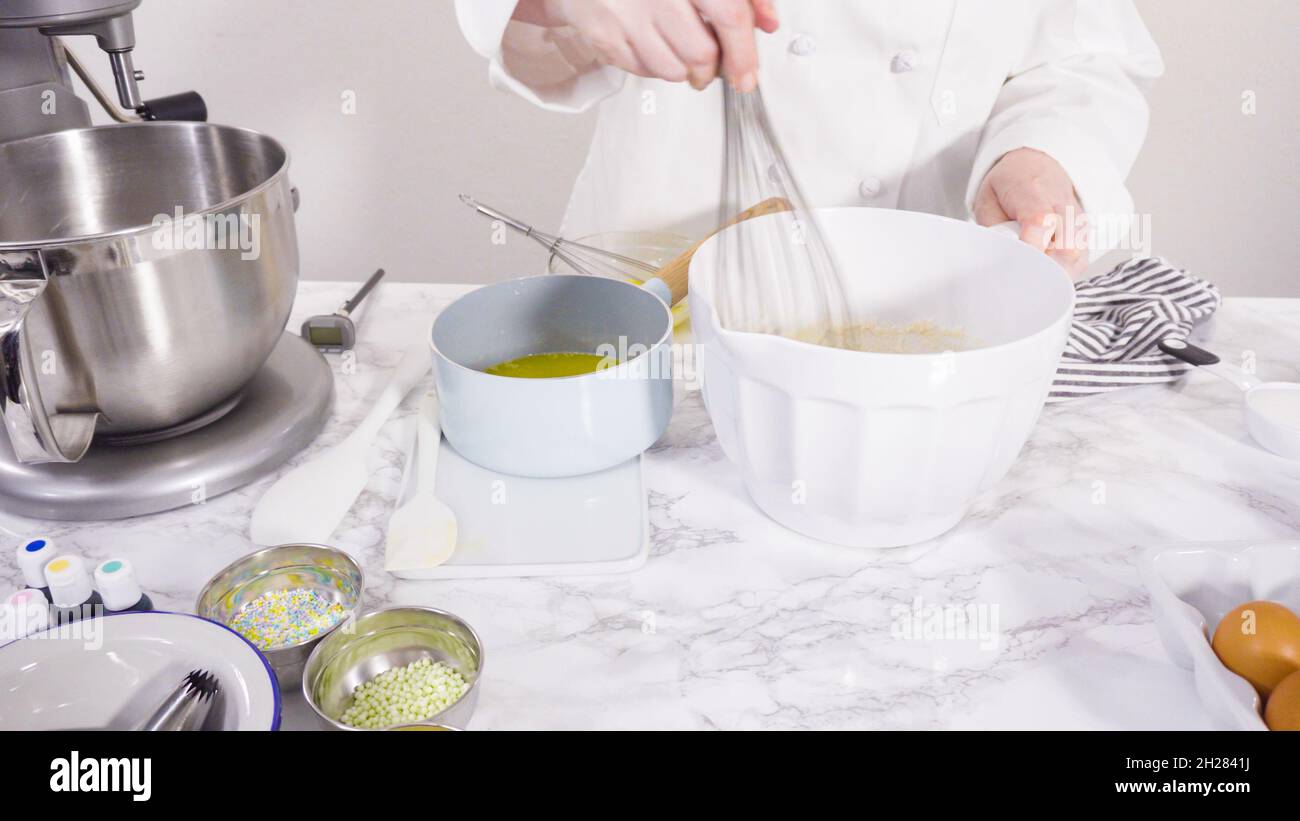 Mixing ingredients to bake sheet cake with Italian buttercream frosting ...