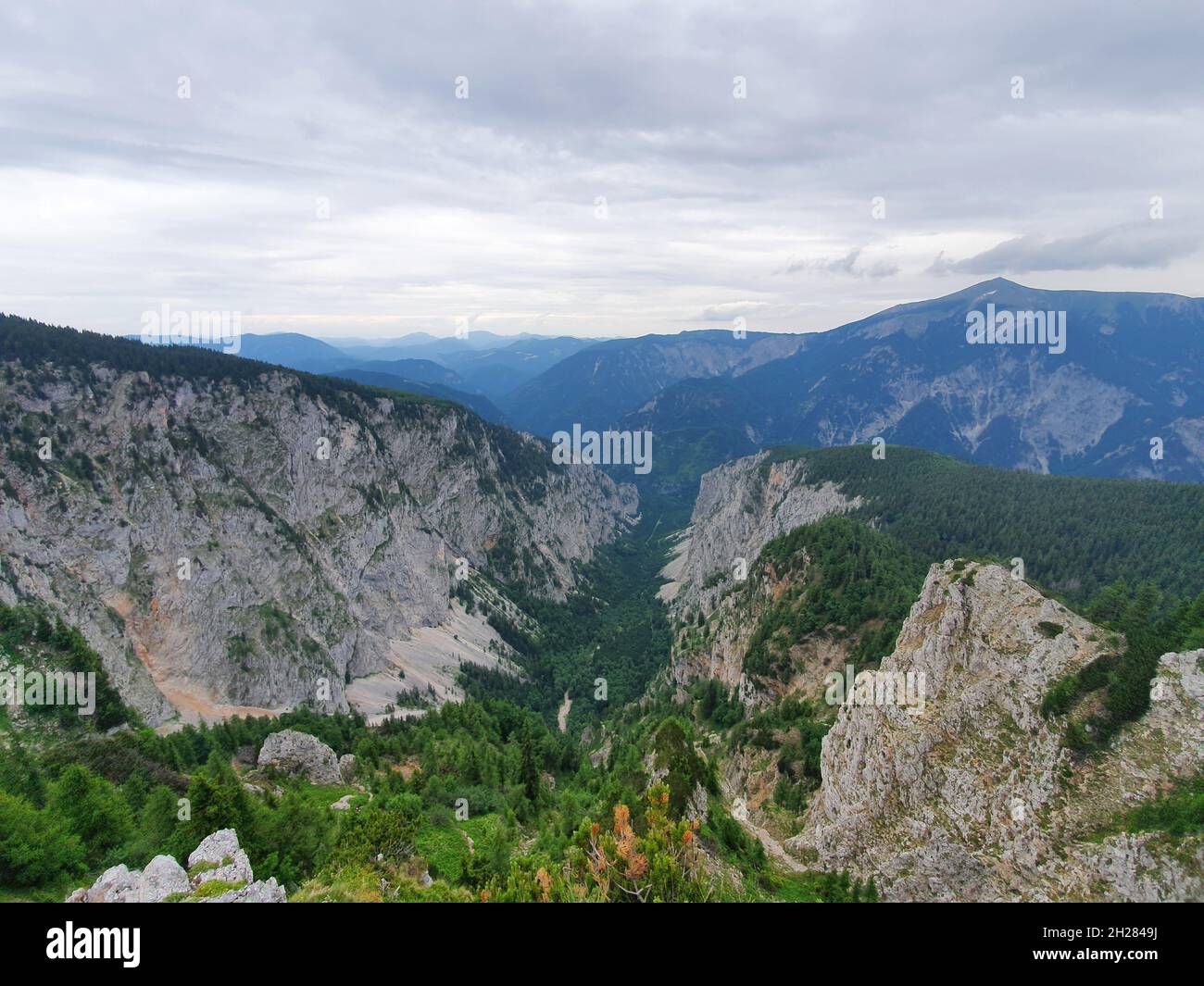High angle shot of a mountainous landscape with steep cliffs and ...