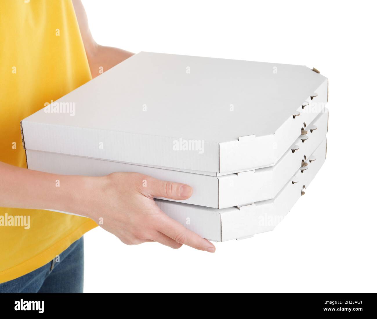 Woman holding cardboard pizza boxes on white background Stock Photo - Alamy