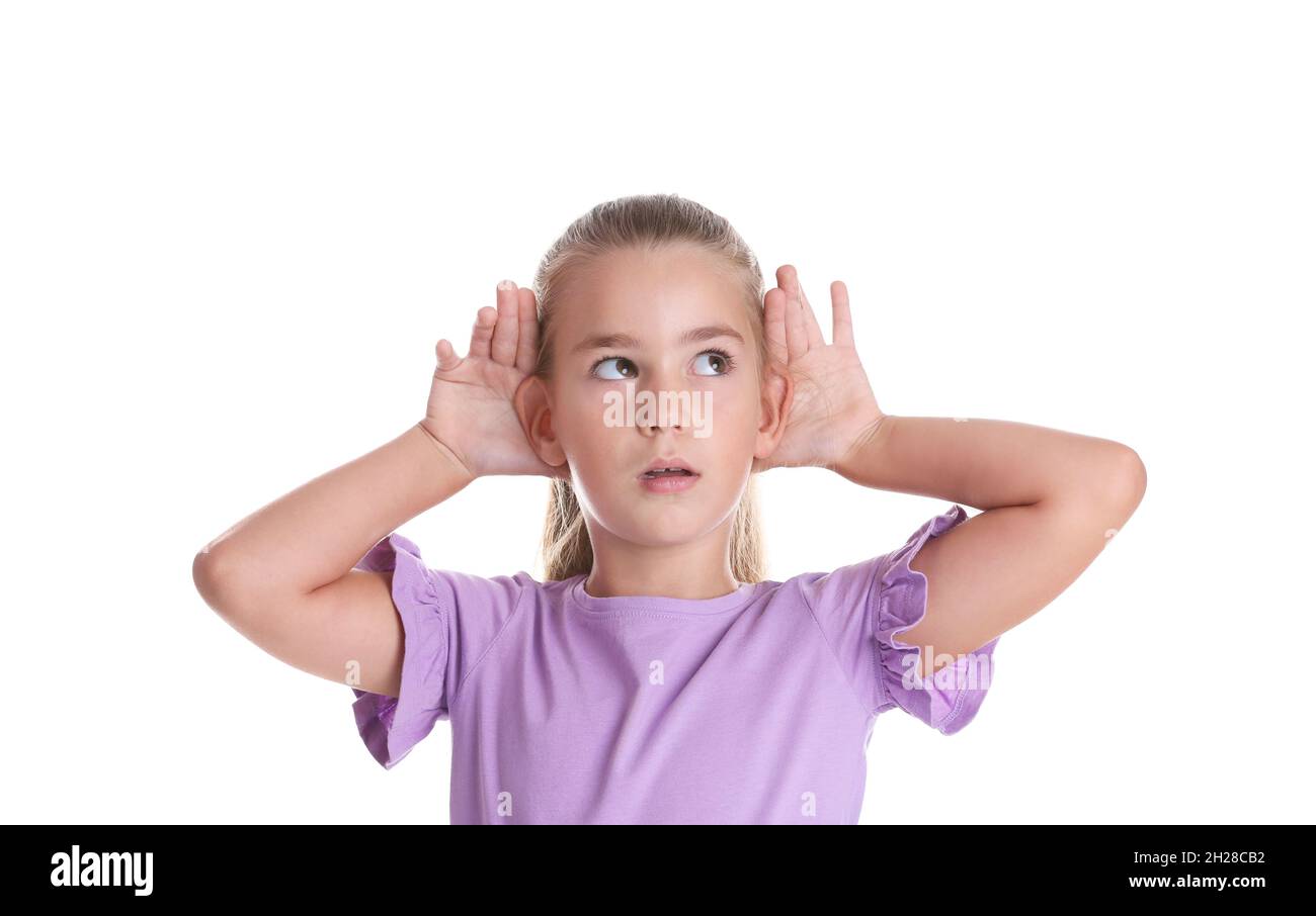 Cute little girl with hearing problem on white background Stock Photo ...