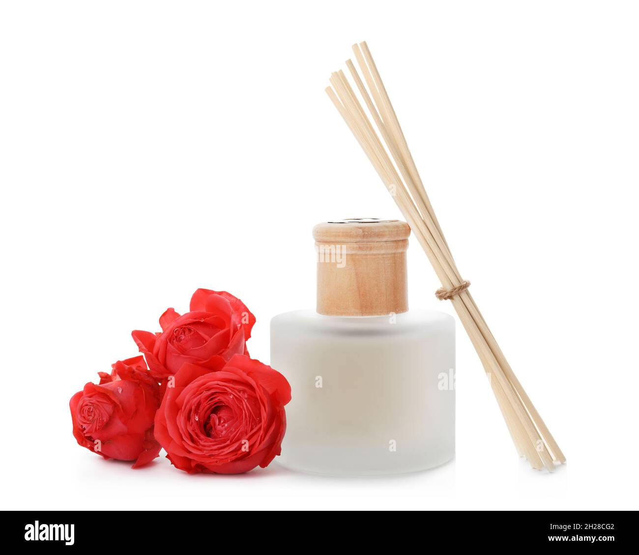 Aromatic reed freshener and roses on white background Stock Photo - Alamy