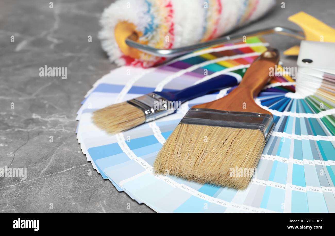 Set of decorator's tools on grey background Stock Photo - Alamy
