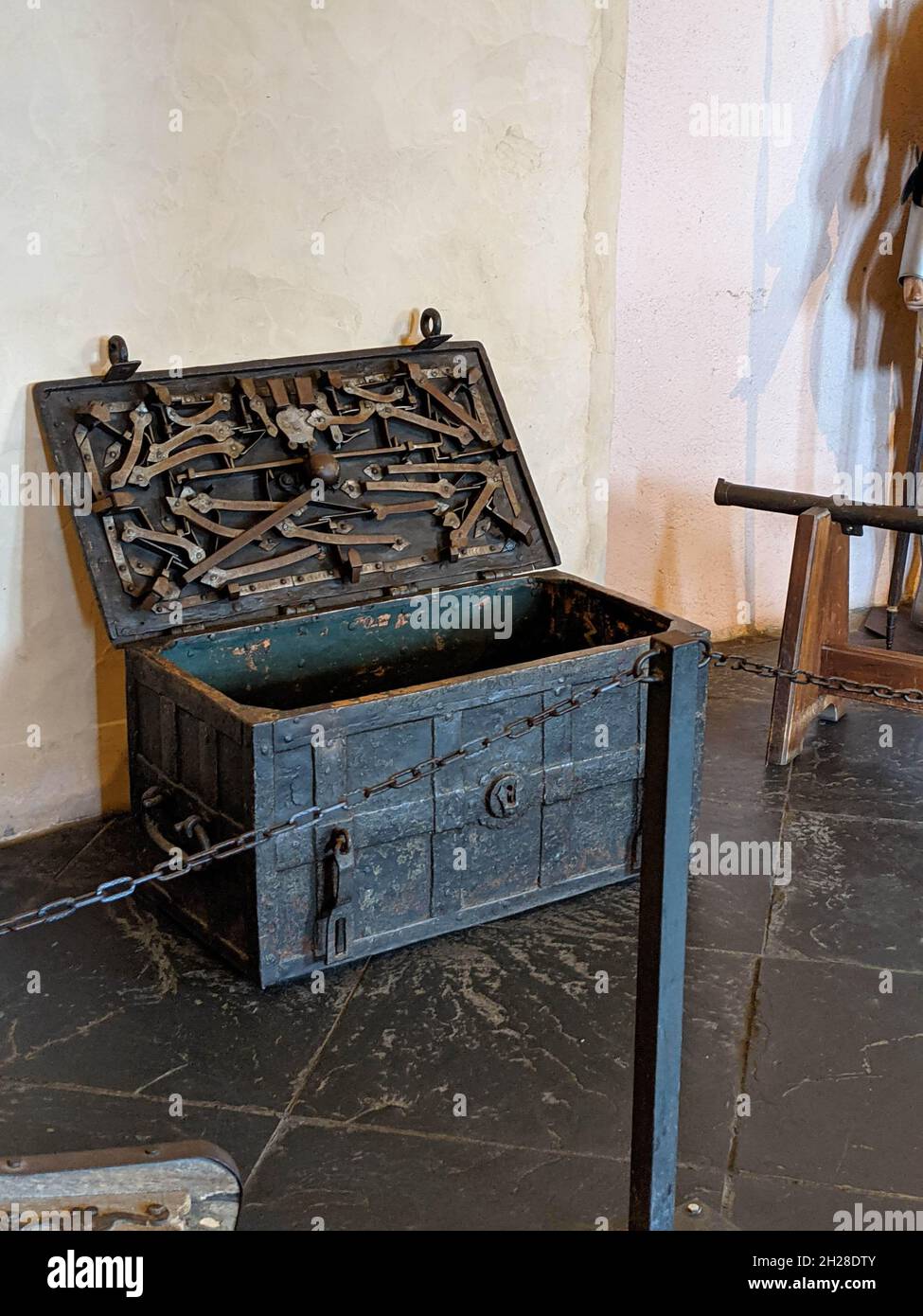 Open iron chest with rusted tools Stock Photo - Alamy