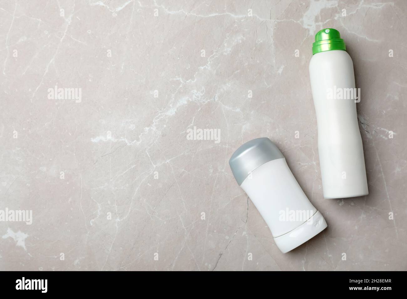 Different deodorants on light background, top view. Skin care Stock ...