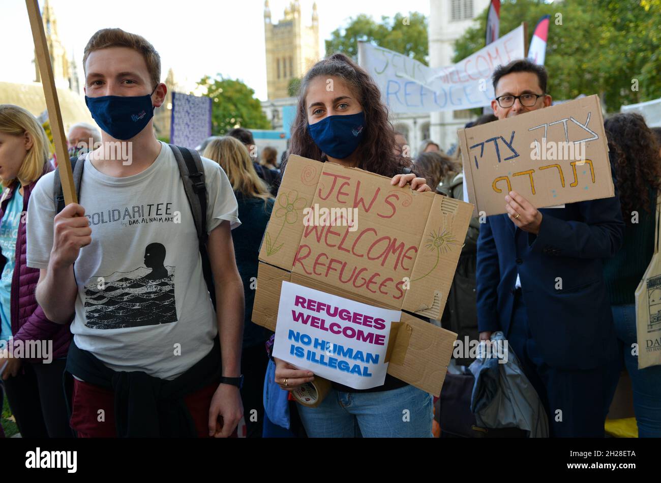 Protesters hold placards during the demonstration. Demonstrators ...