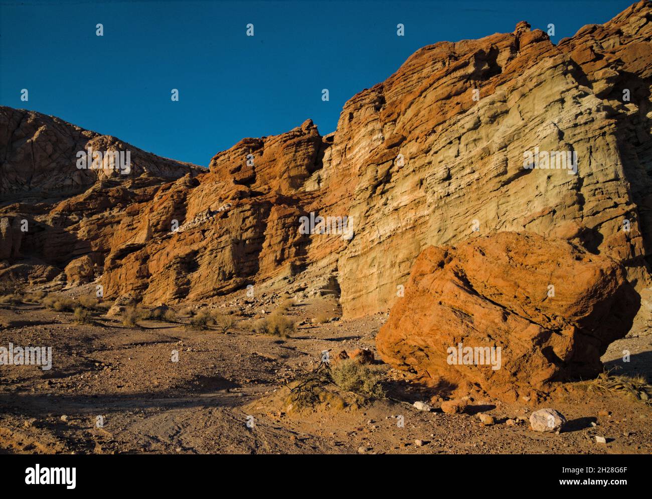 Red rock huge stone formation in desert vivid in color and rich in ...